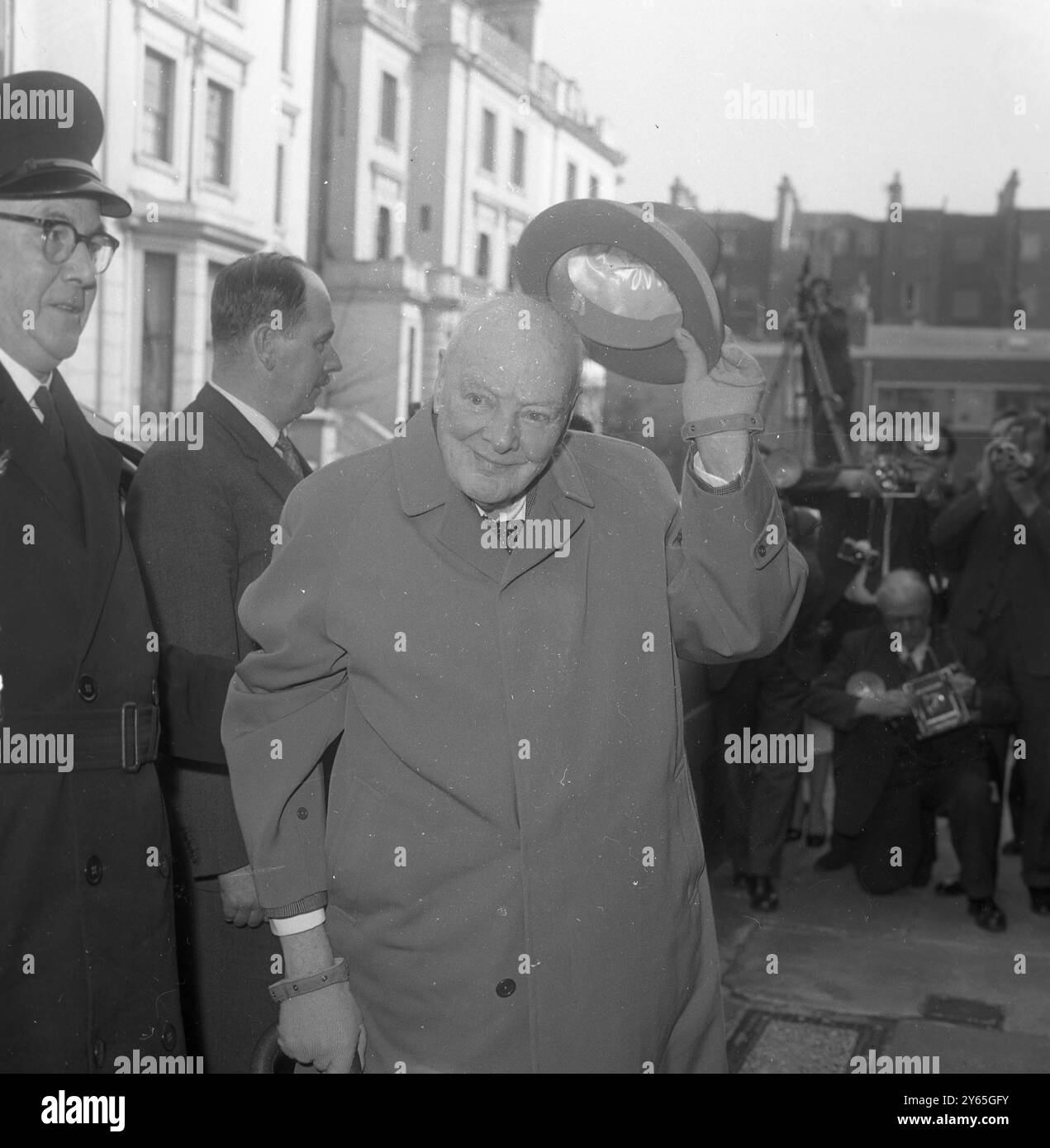 Churchill Home A wave from Sir Winston Churchill as he arrives at his ...