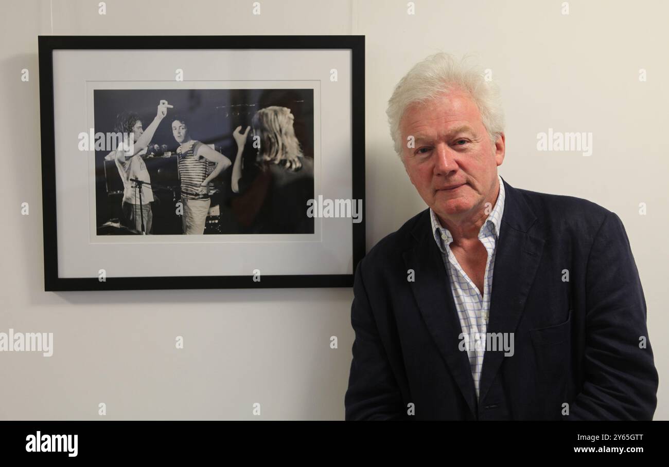 Homer Sykes photographer with photograph of his of paul Mccartney and ...