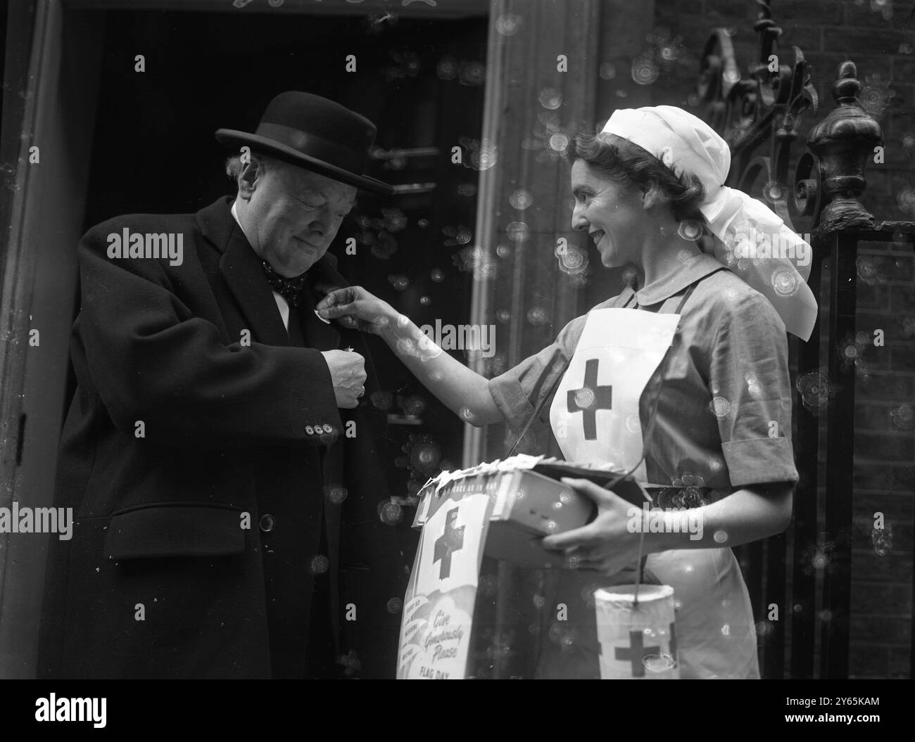 Premier Pays Up . Miss Anne Barry , a member of the British Red Cross ...