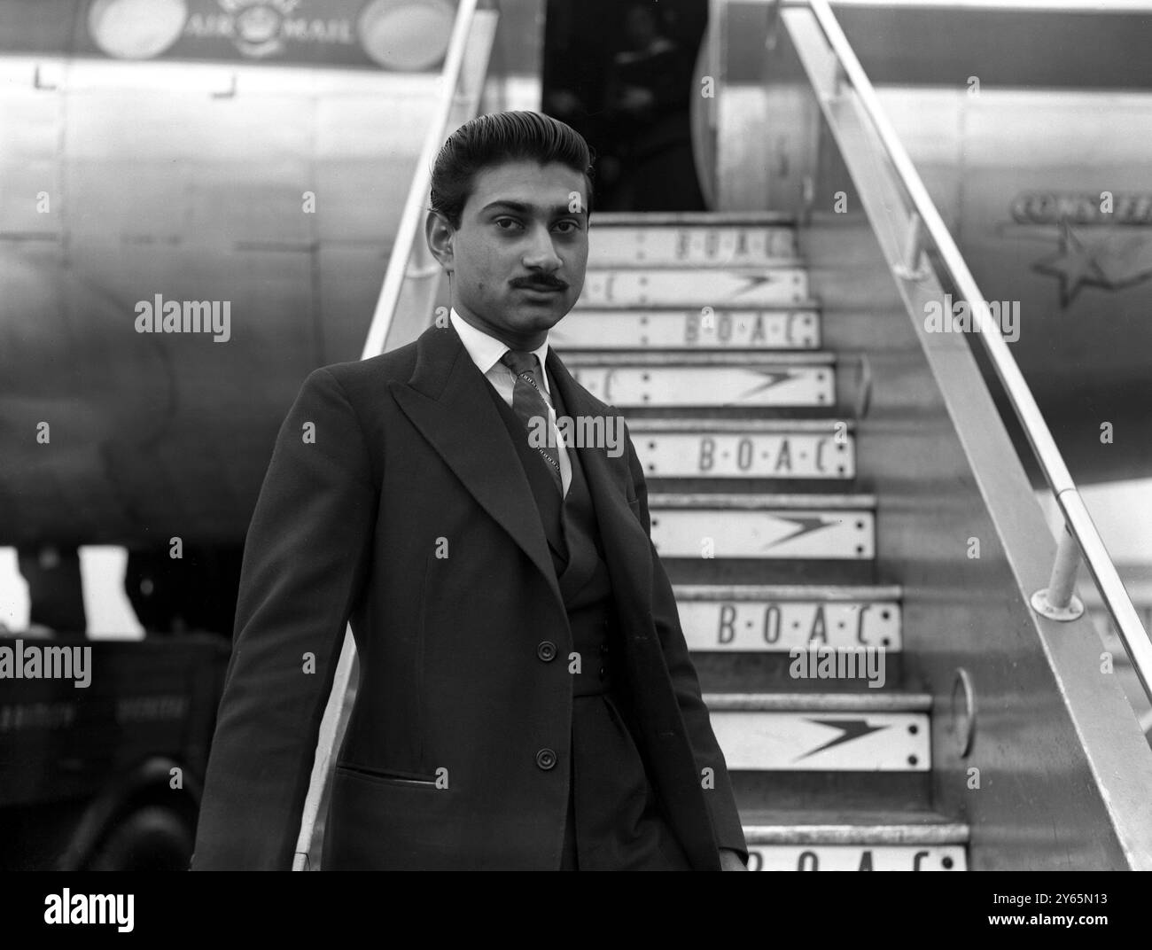 Pictured as he boarded a BOAC liner for Karachi is Cambridge-educated Mir Ali Murad Khan Talfur ...