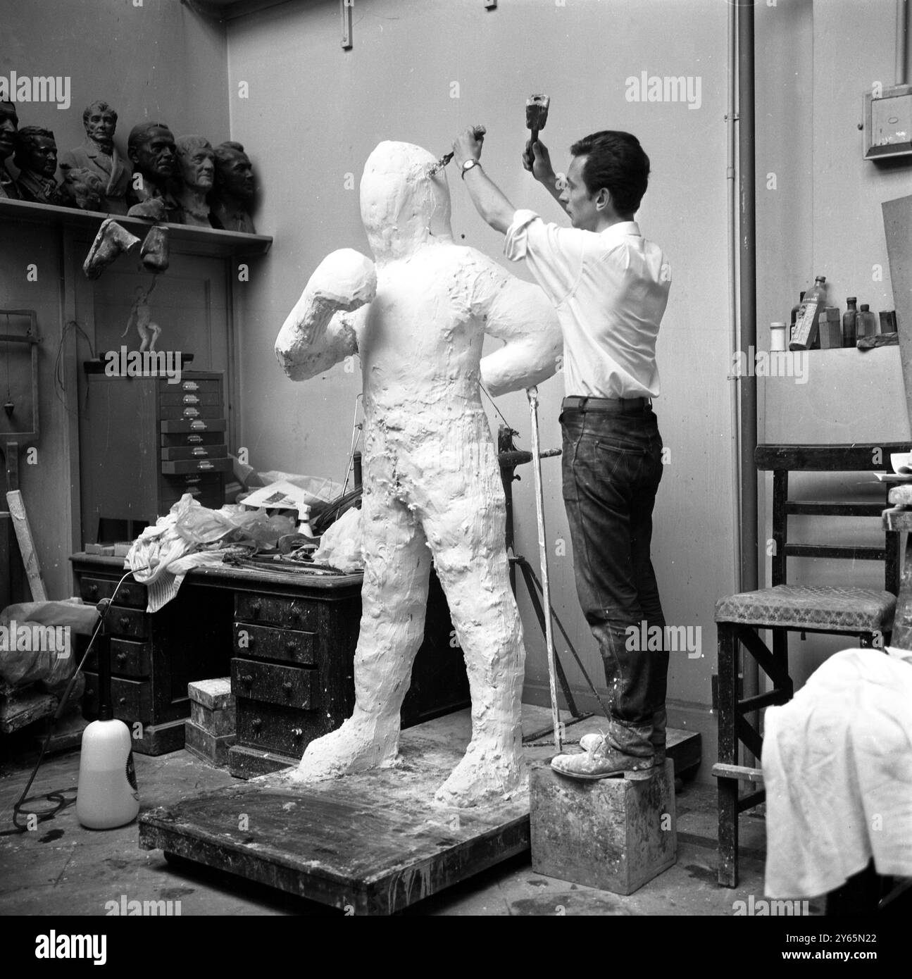 London ; Sculptor , George Hopkins is working on a model of former ...