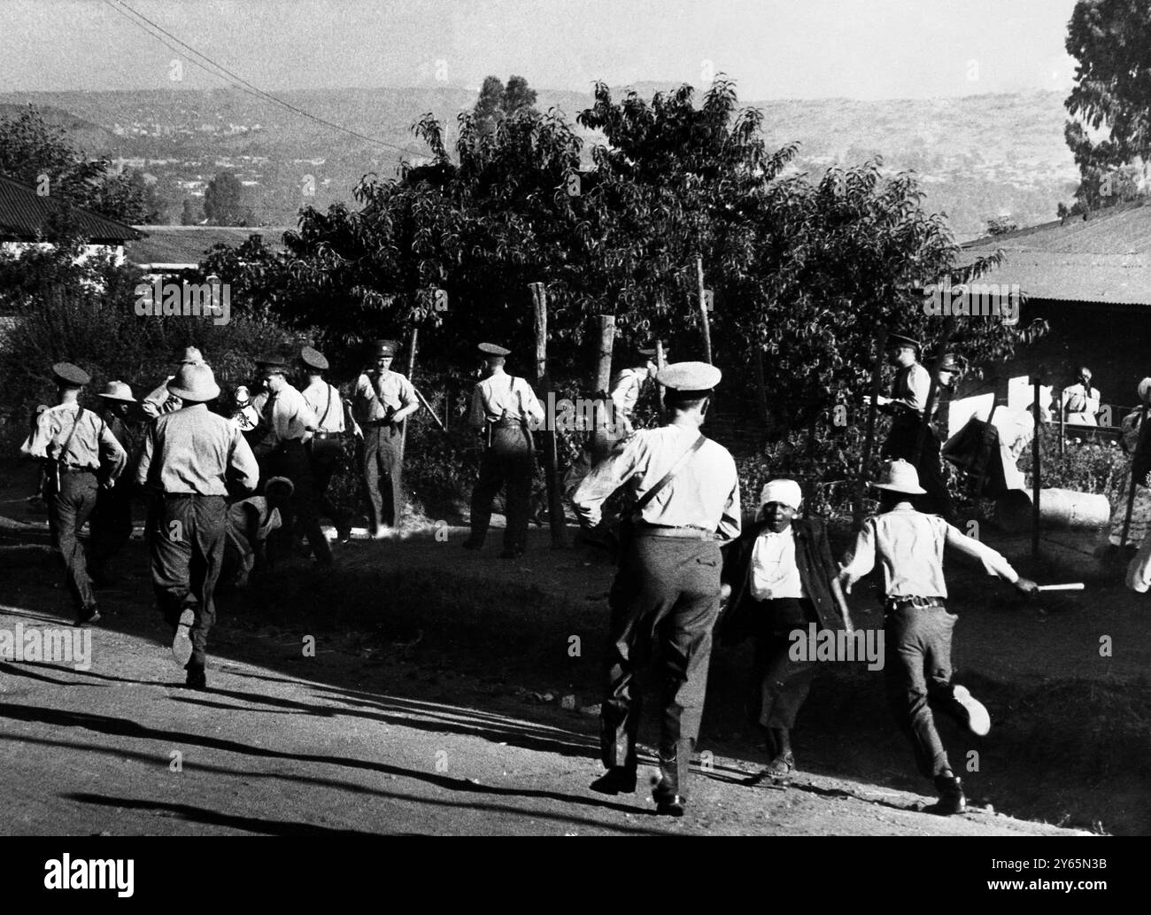 Pretoria , South Africa : One black woman falls and another is caught ...