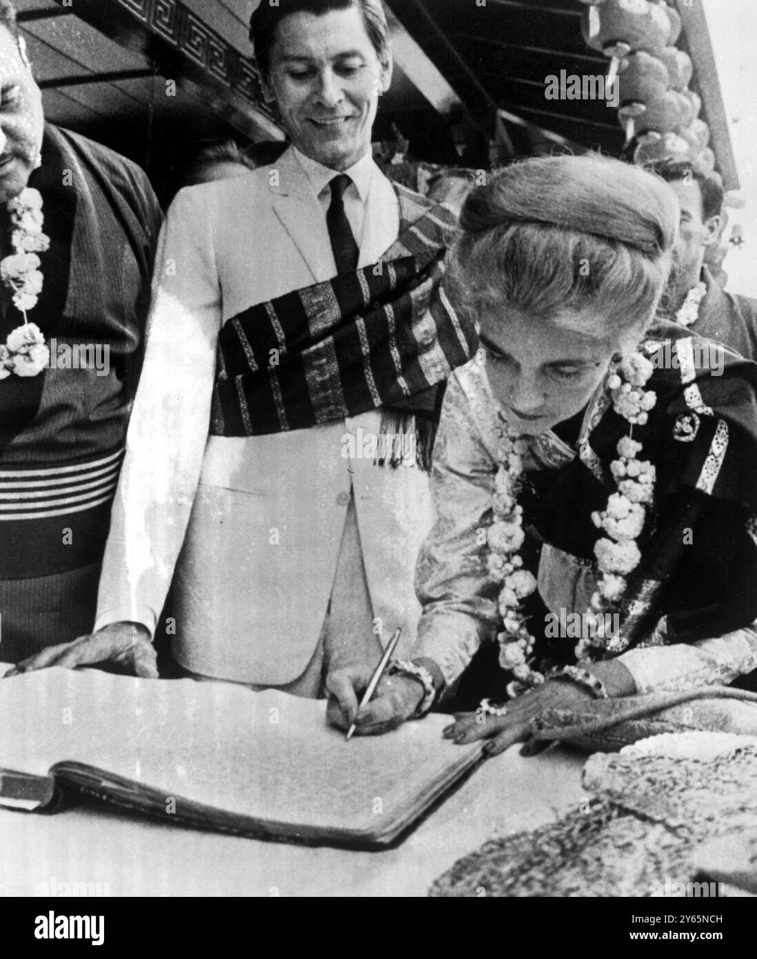 Juitepec , Mexico : Heiress Barbara Hutton signs the registry after her ...