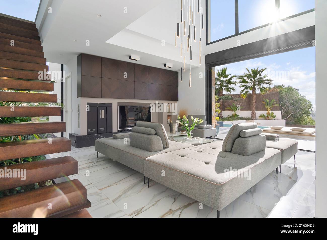 Living room of a luxurious and modern villa with high ceilings, elegant ...