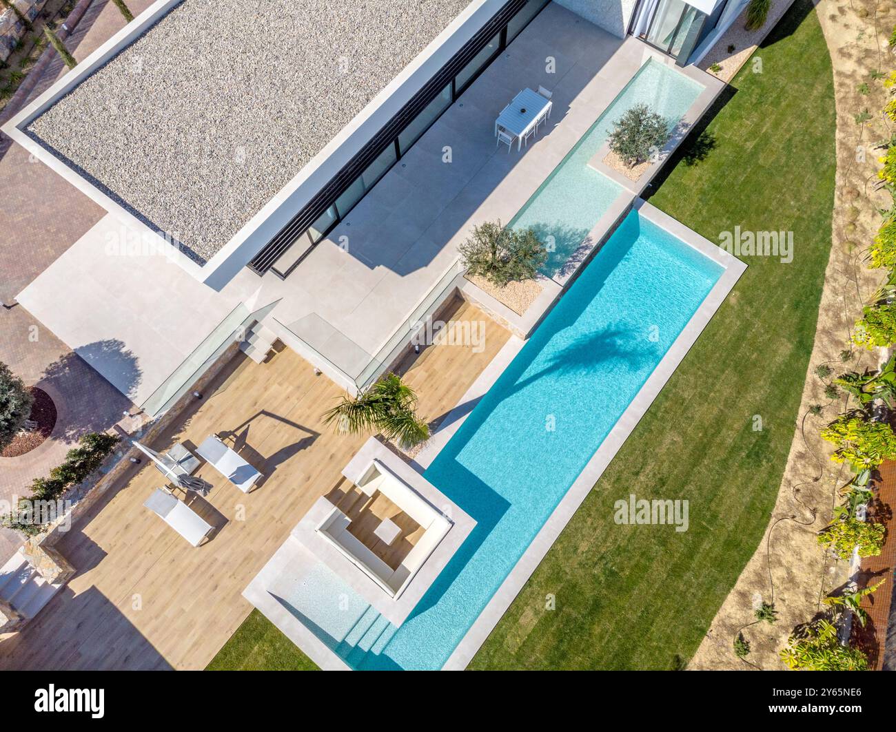 Aerial image capturing a luxurious Mediterranean villa, featuring a ...