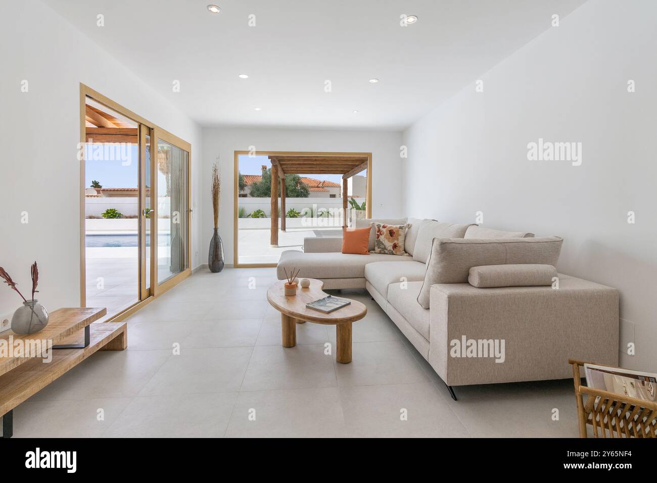 This image features a modern, airy interior of an Ibizan Villa ...