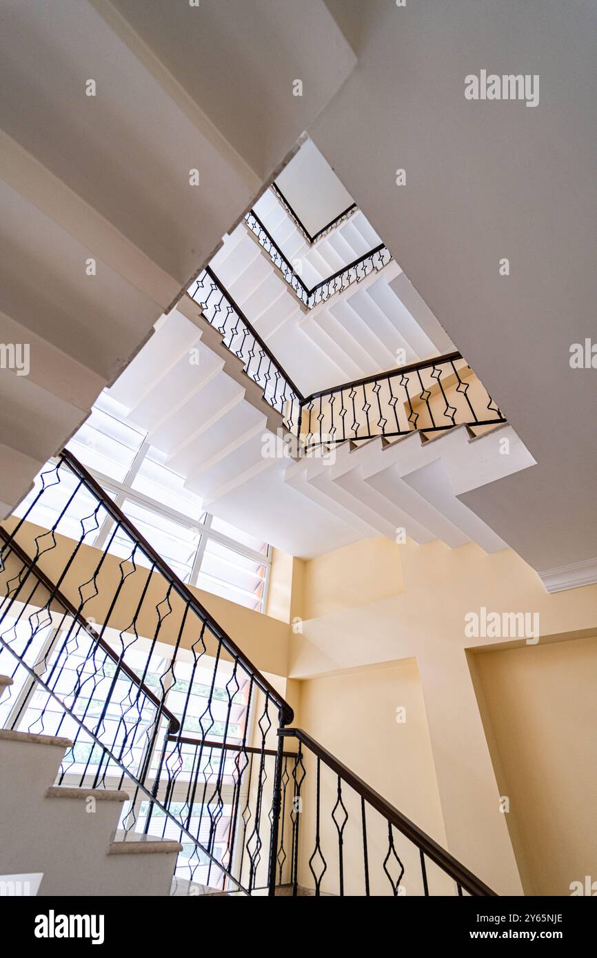 A captivating view from the bottom of a multilevel spiral staircase ...