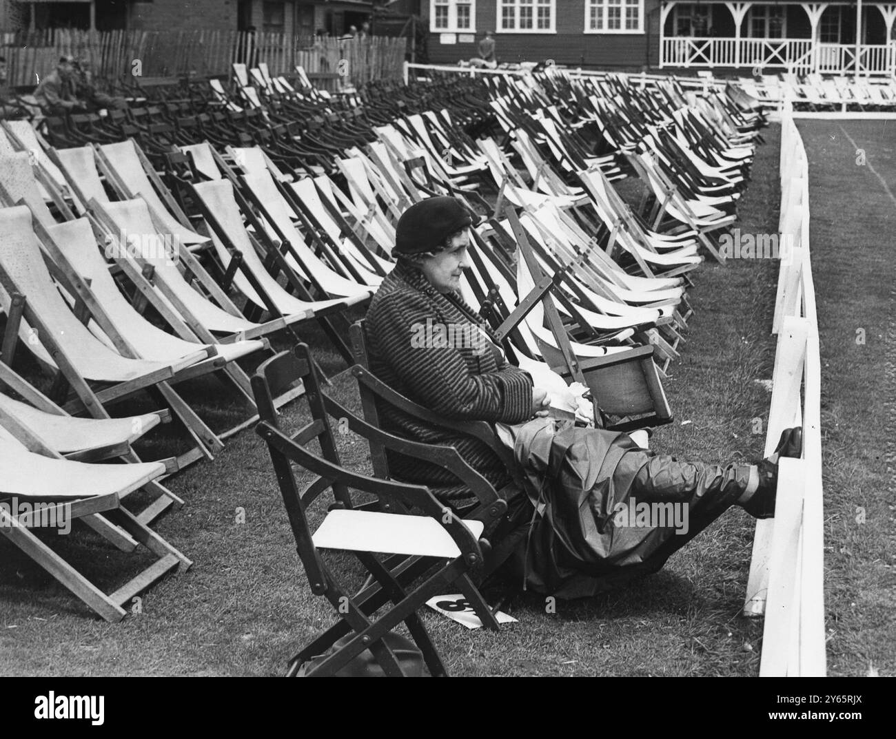 In glorious isolation , this hardy woman cricket enthusiast sat in the ...