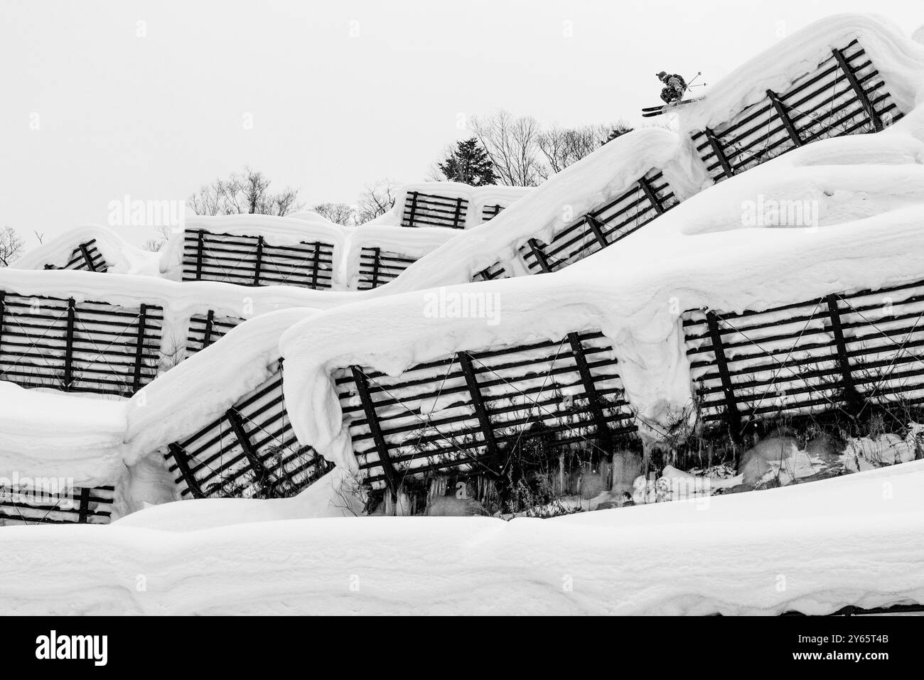 Dramatic winter scene in Niseko, Japan, featuring snow-laden barriers ...