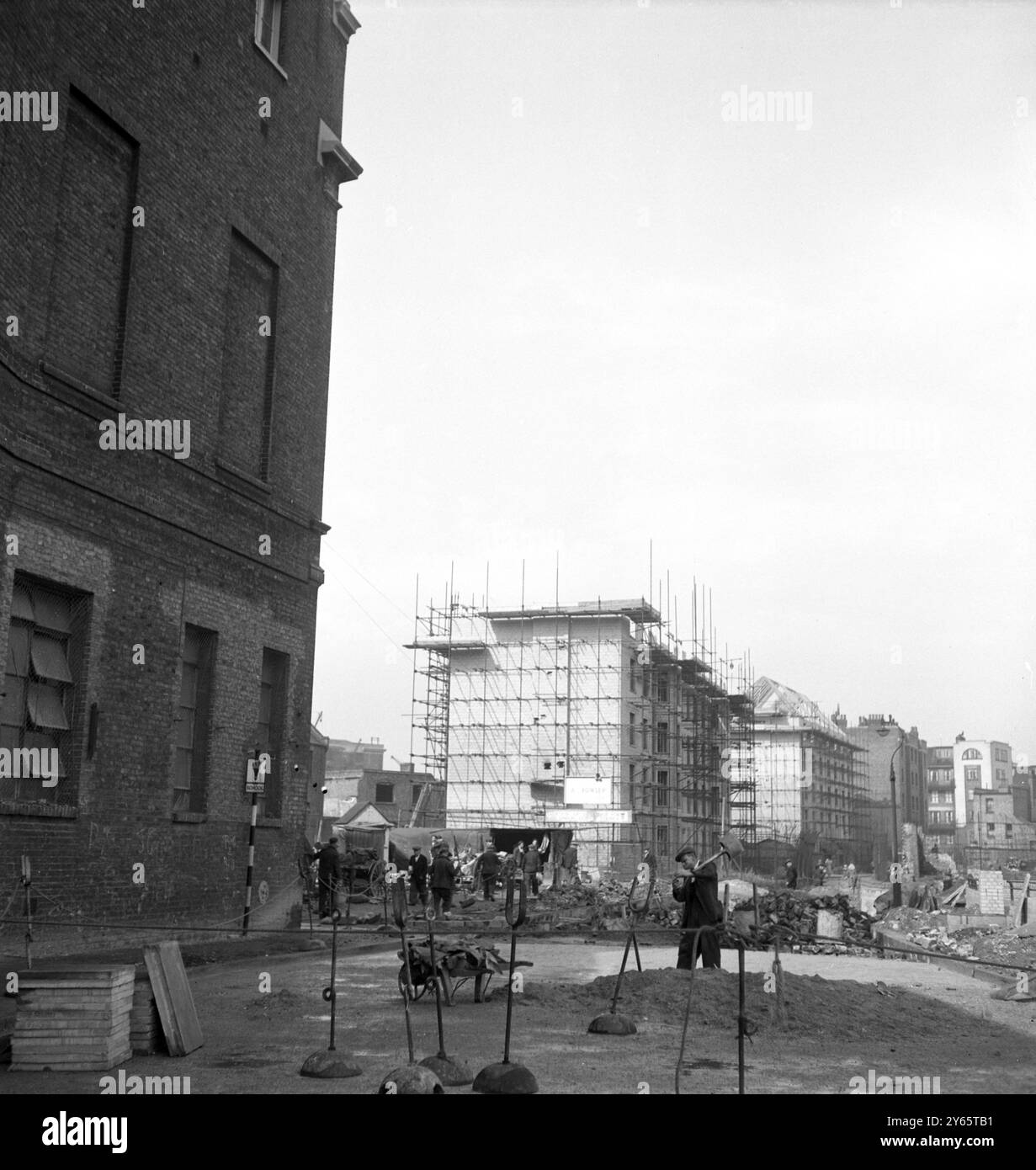 The construction of new buildings in Wapping , the London dock area ...