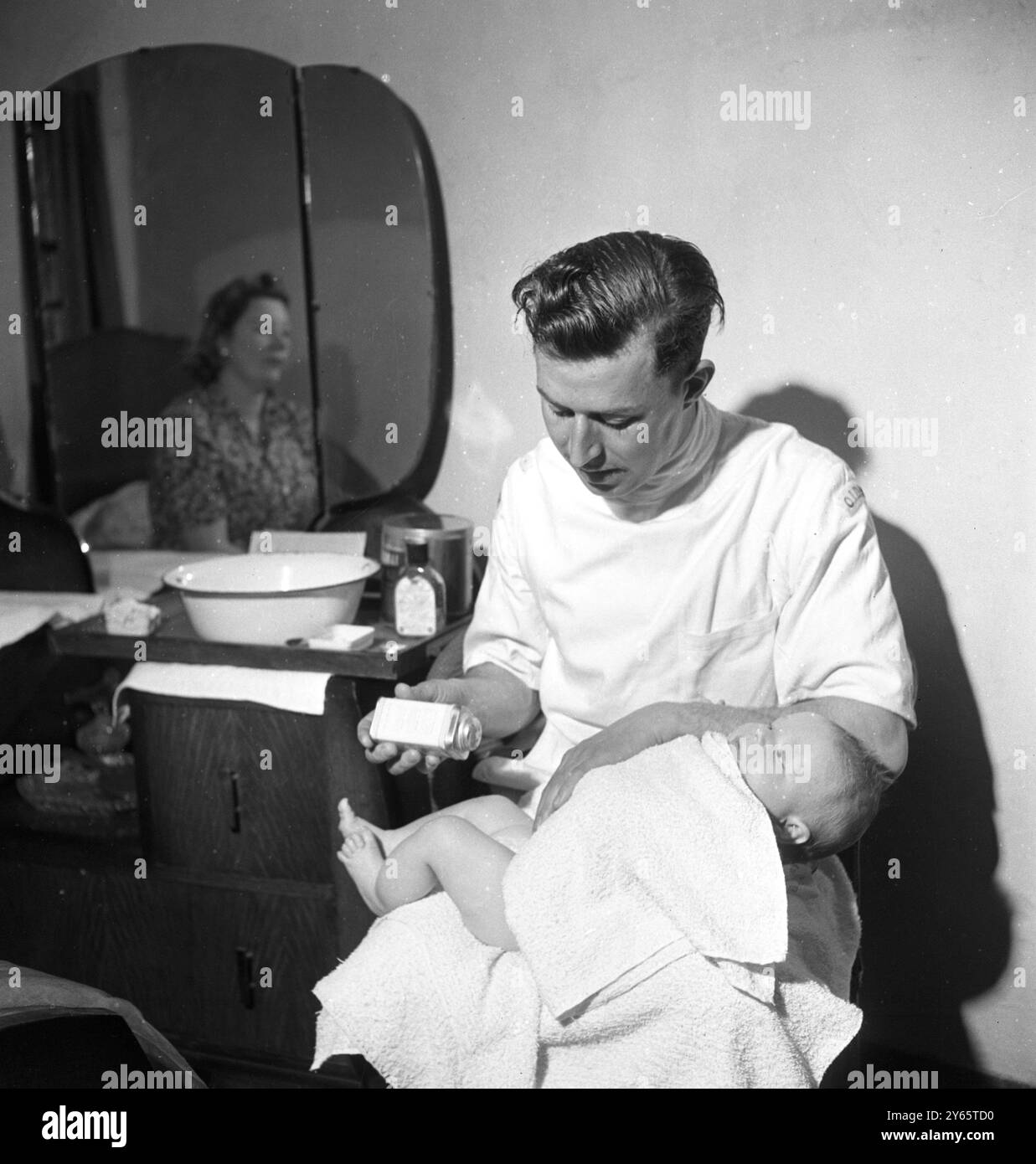 Helping new mothers with their childcare and powdering a baby ' s ...