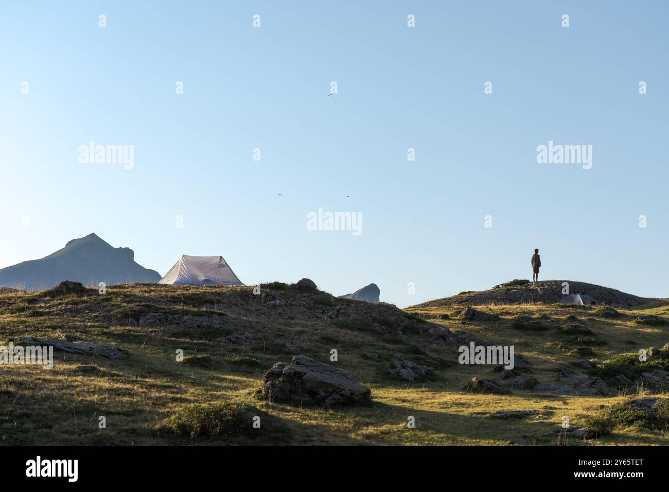 A serene camping scene in the French Pyrenees, Lacs d'Ayous, with ...