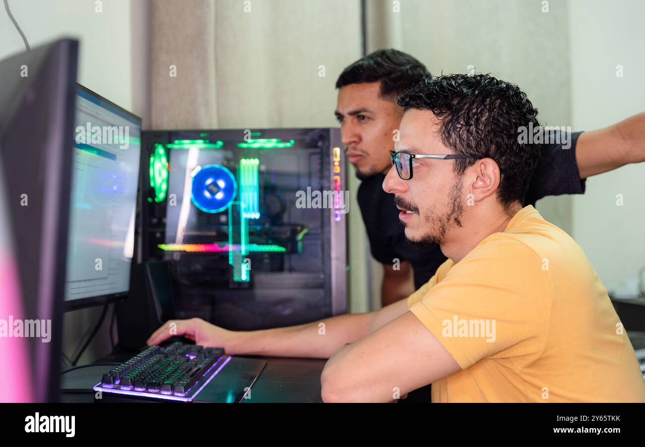 Two gay men share a joyful moment while gaming together They are both ...