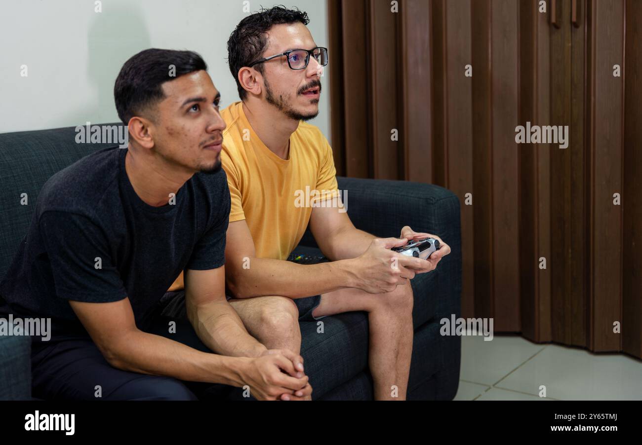 A gay couple, part of the LGBTQIA+ community, share a moment of ...