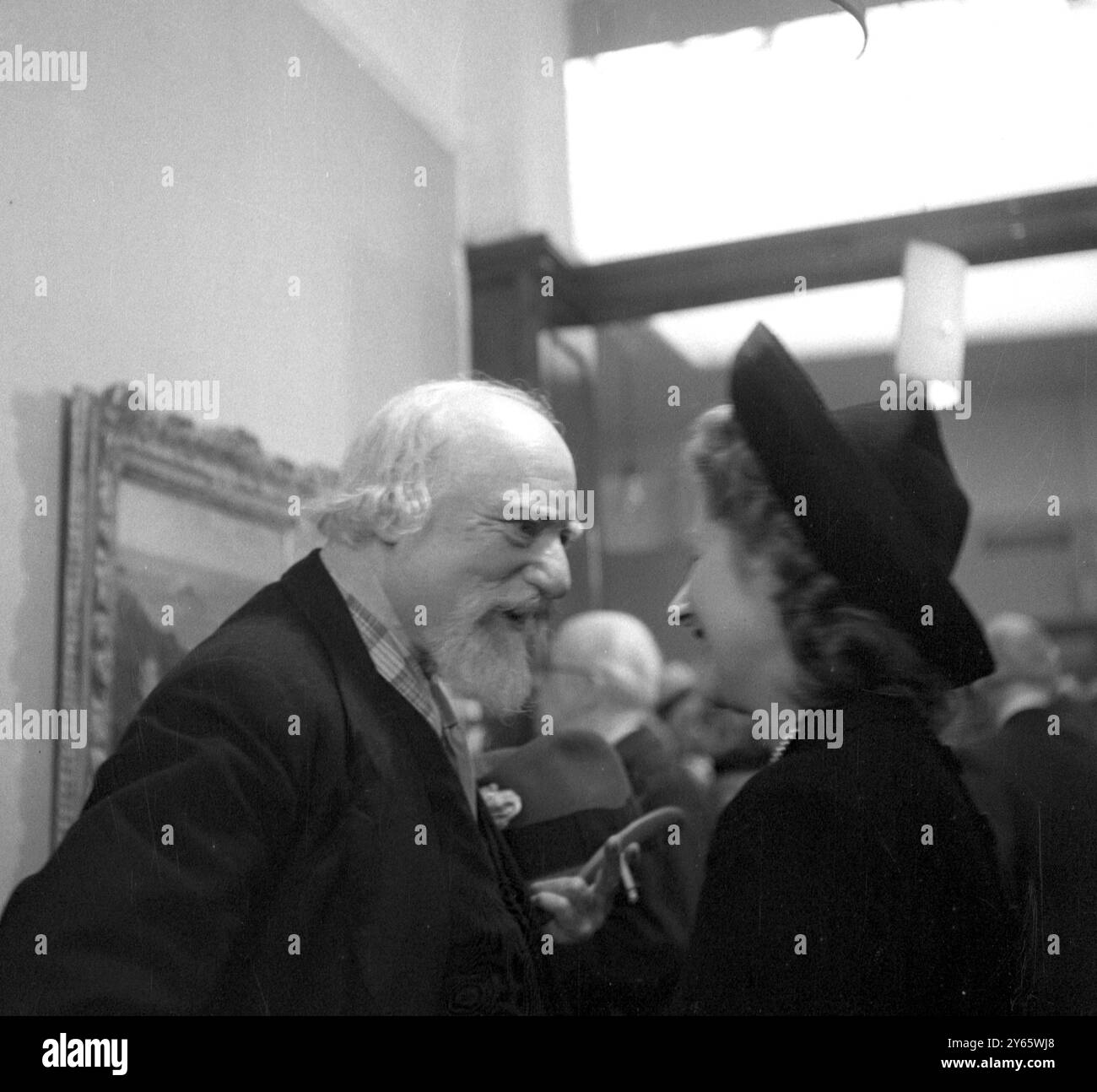The celebrated , Welsh , portrait painter , Augustus John , chatting to ...