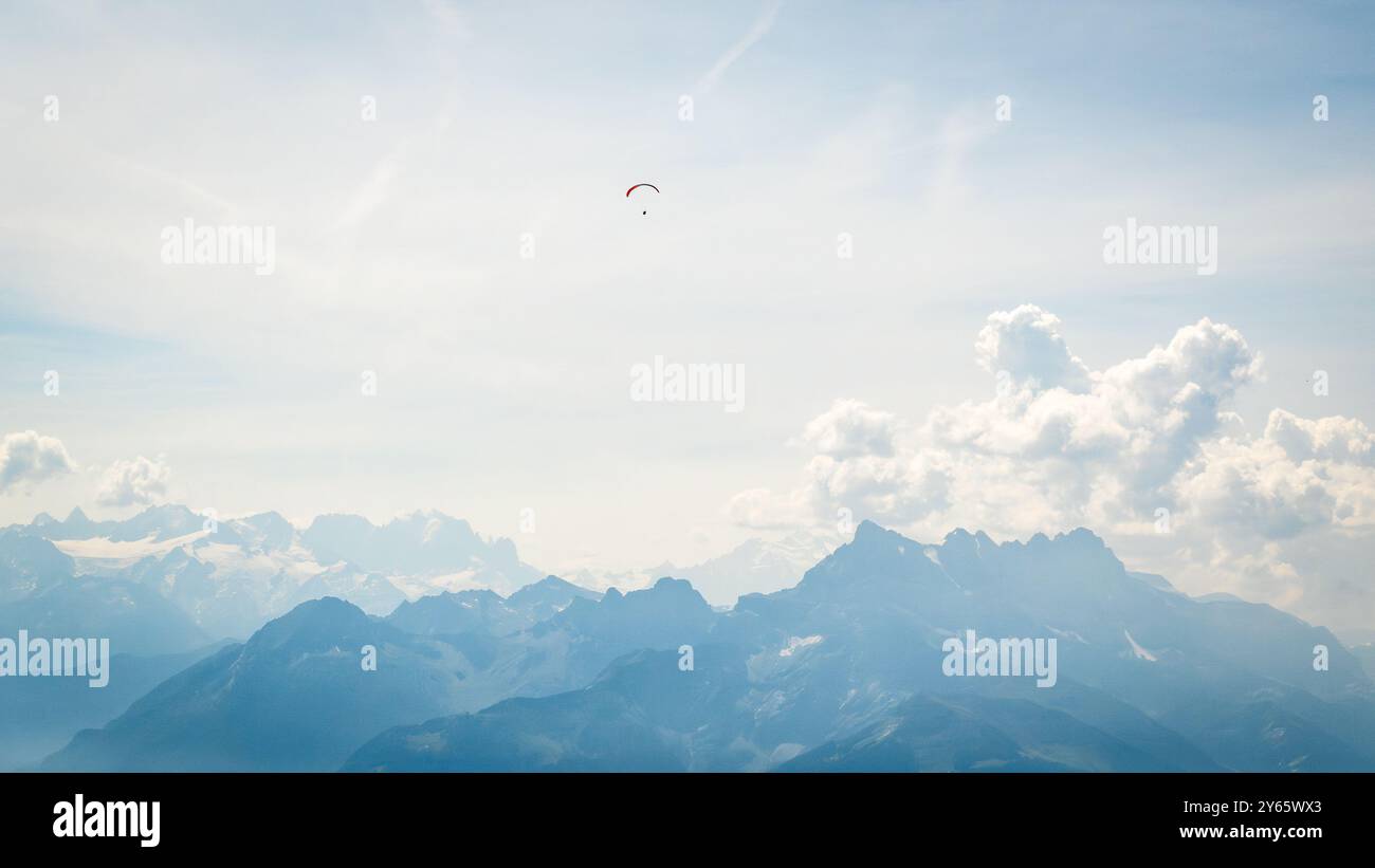A breathtaking view of the Swiss Alps under a clear sky, featuring a ...
