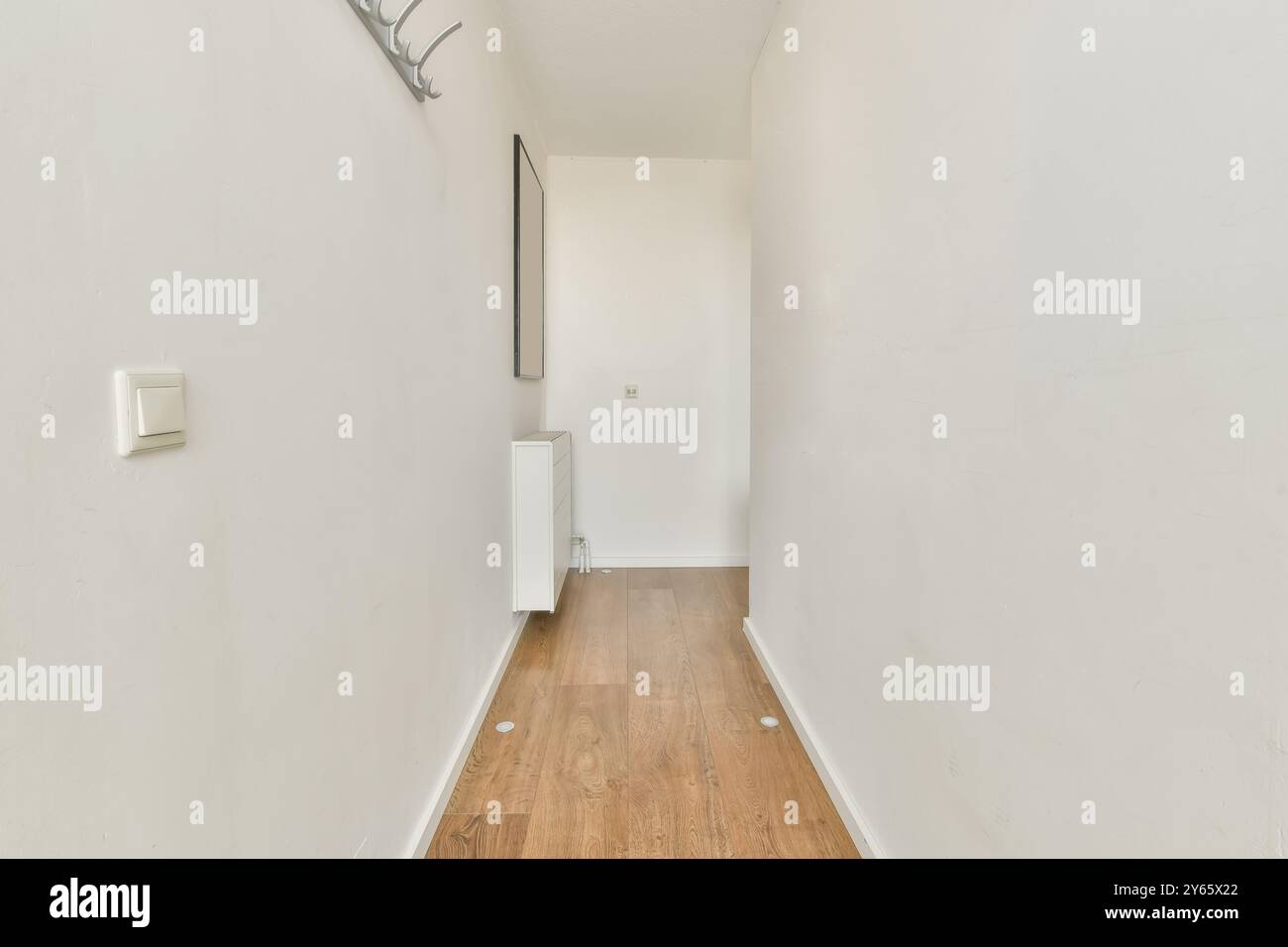 This image showcases a clean, minimalist corridor featuring sleek ...