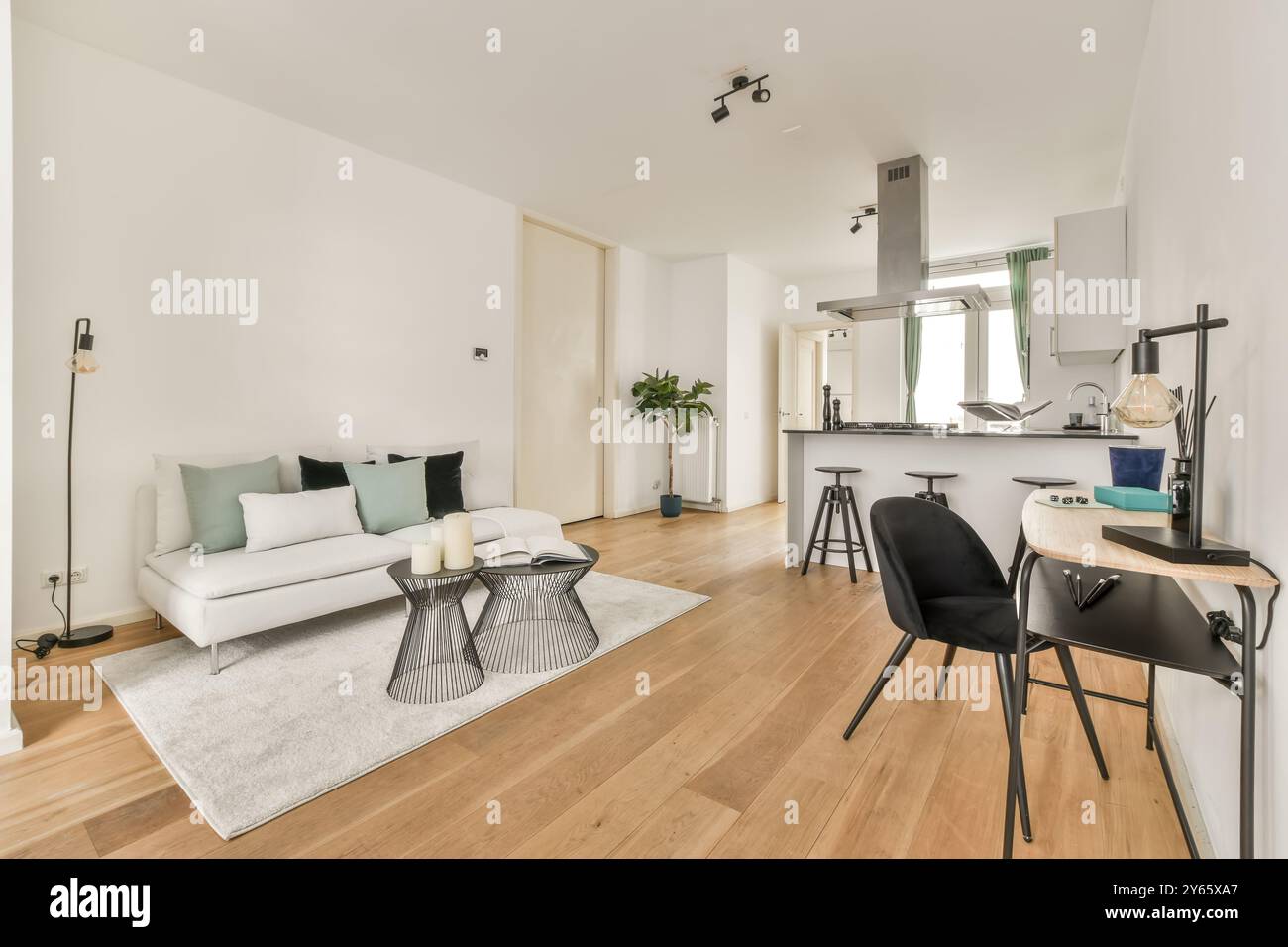 Bright and airy open plan living room seamlessly connected to a kitchen ...