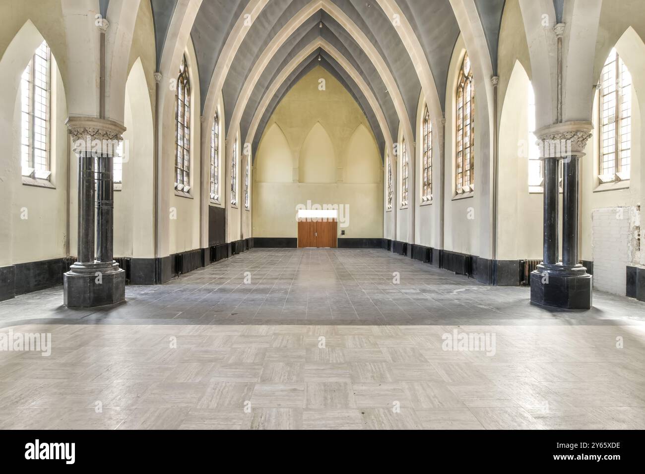 An expansive, unoccupied church hall showcases elegant gothic ...