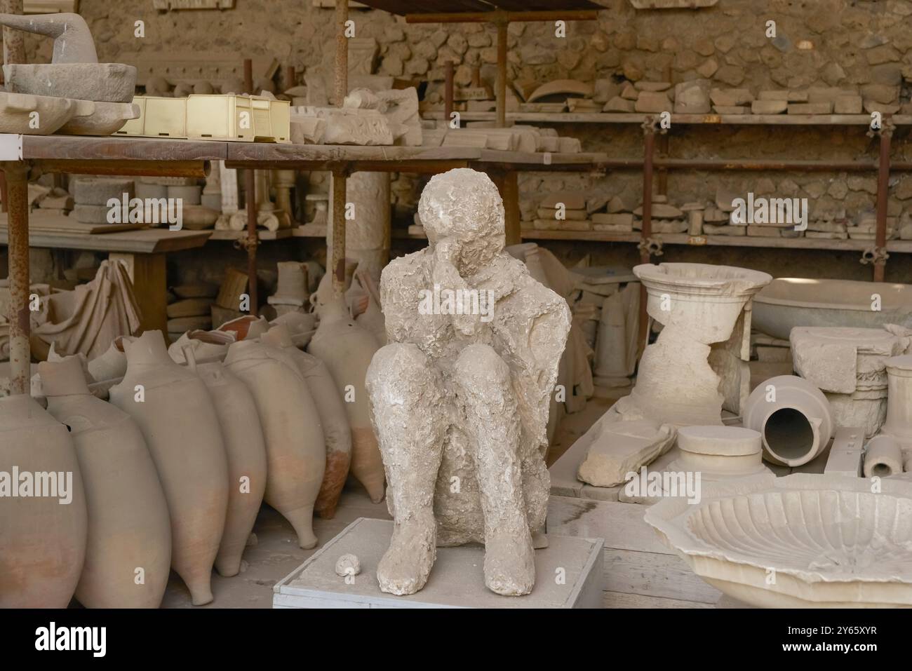 A haunting plaster cast of a victim from the ancient eruption of Mount ...