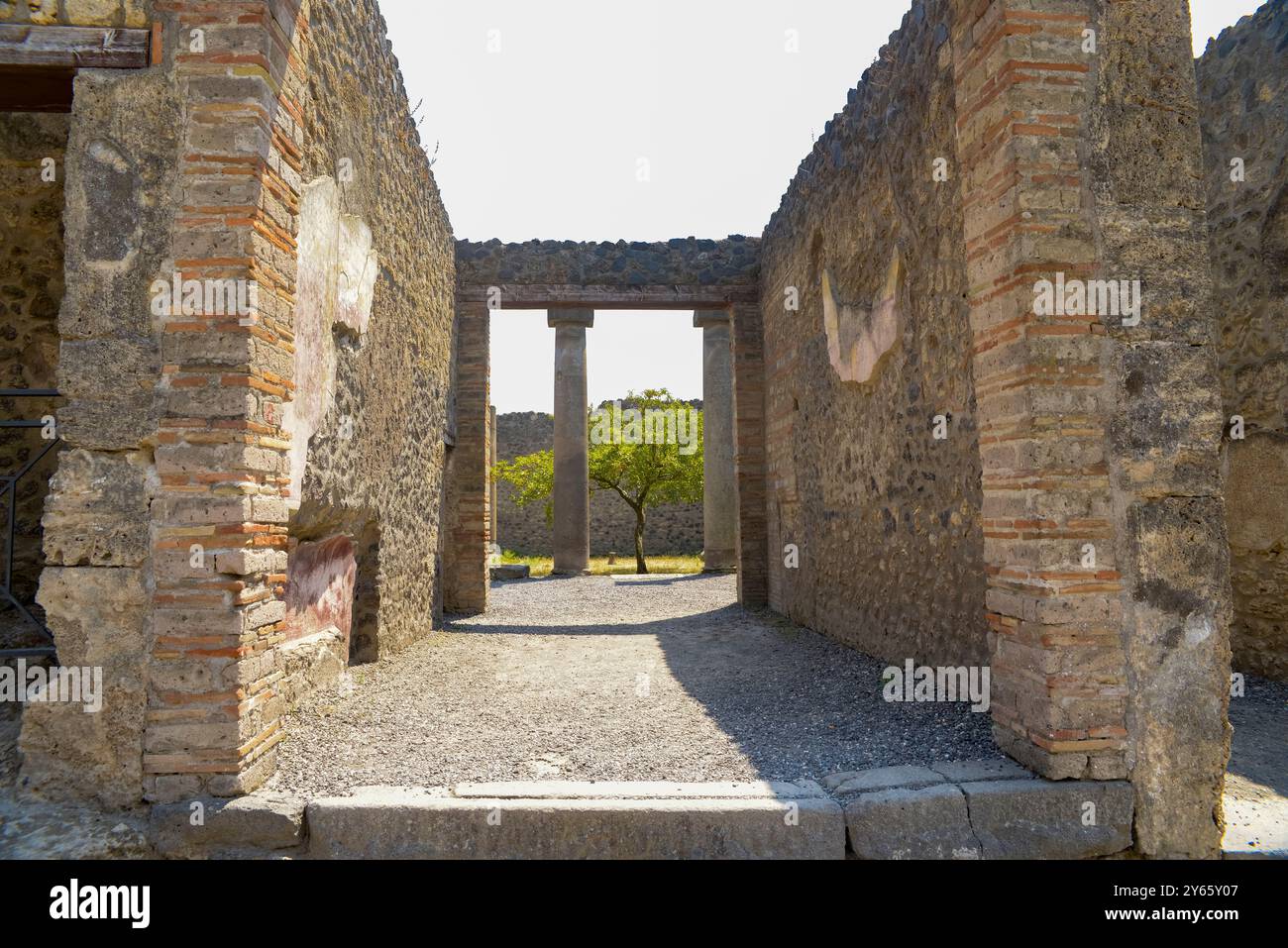 This image captures the historic ruins of Pompeii, featuring aged stone ...