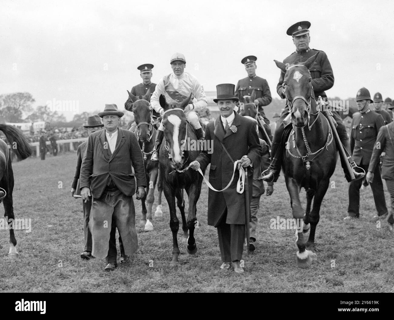 Lord Astor leading in his racehorse , " Saucy Sue " after she won the ...