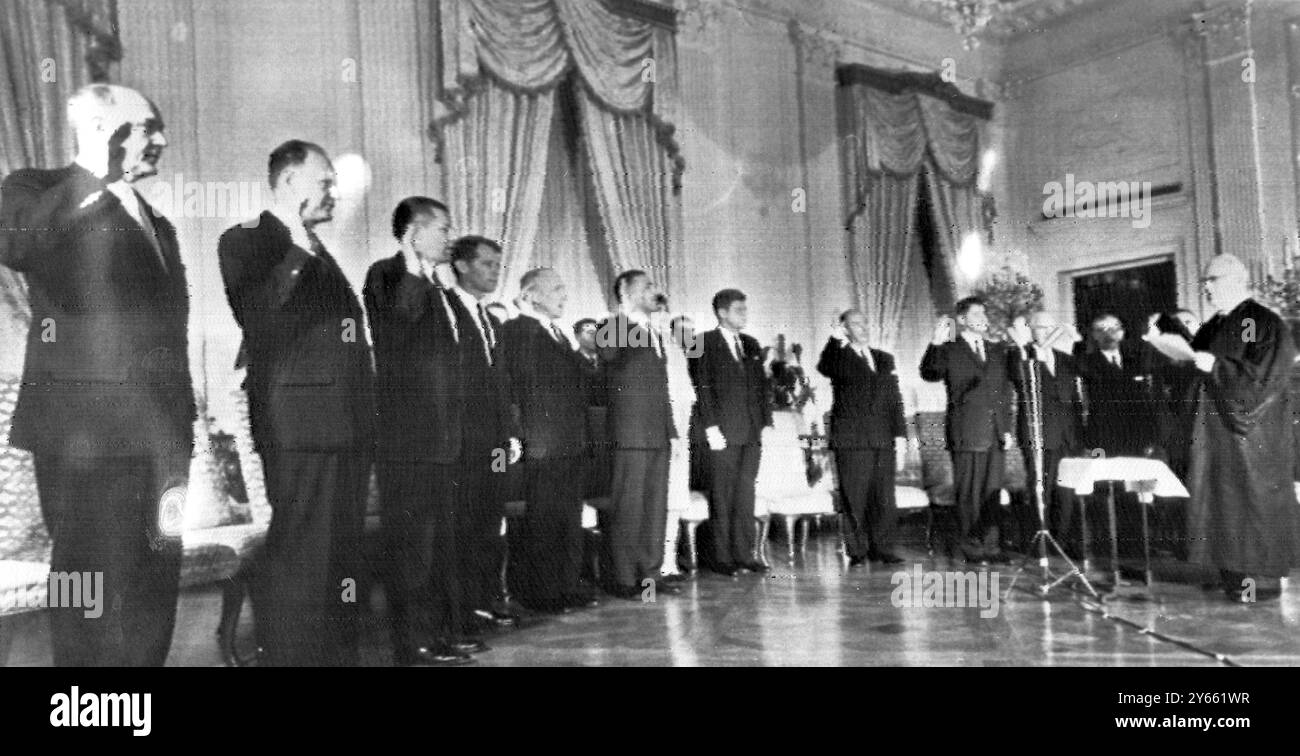 Ten members of the Cabinet of President John Kennedy being sworn in by ...
