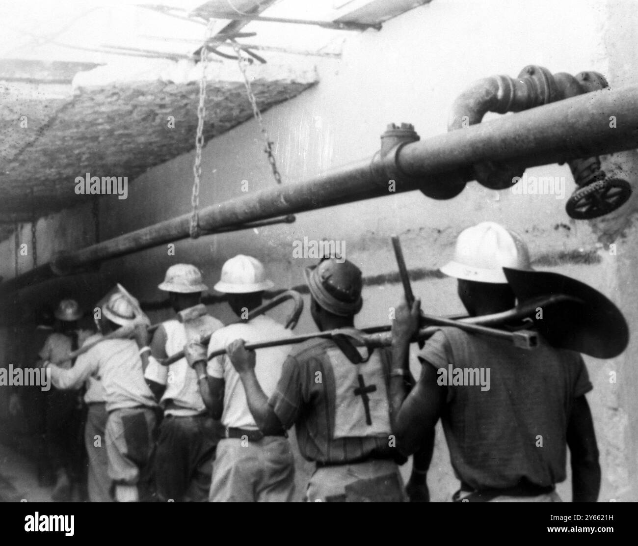 African gold mine workers going underground at the start of a shift at ...