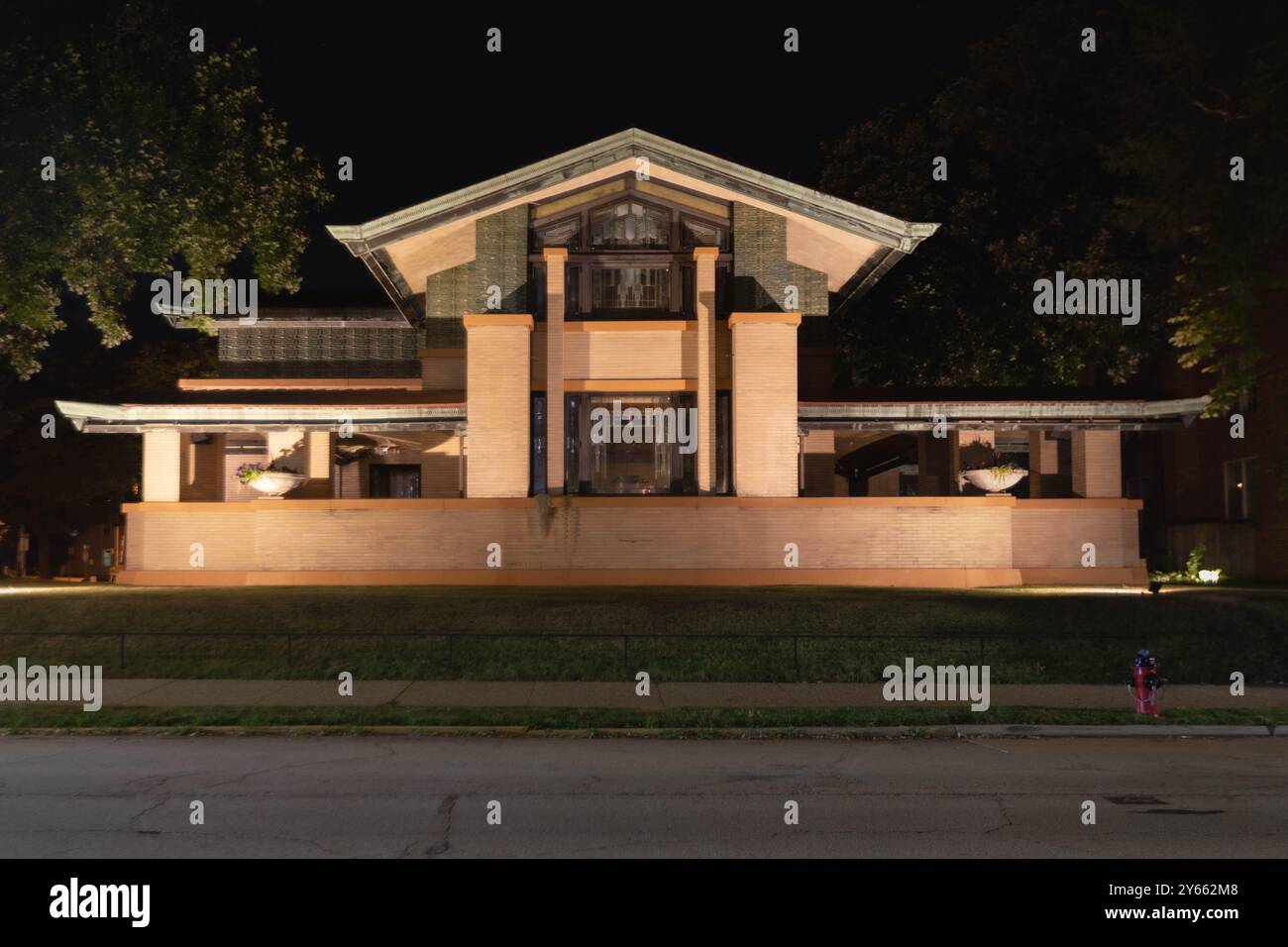 A beautifully lit, iconic architectural building captured at night with ...