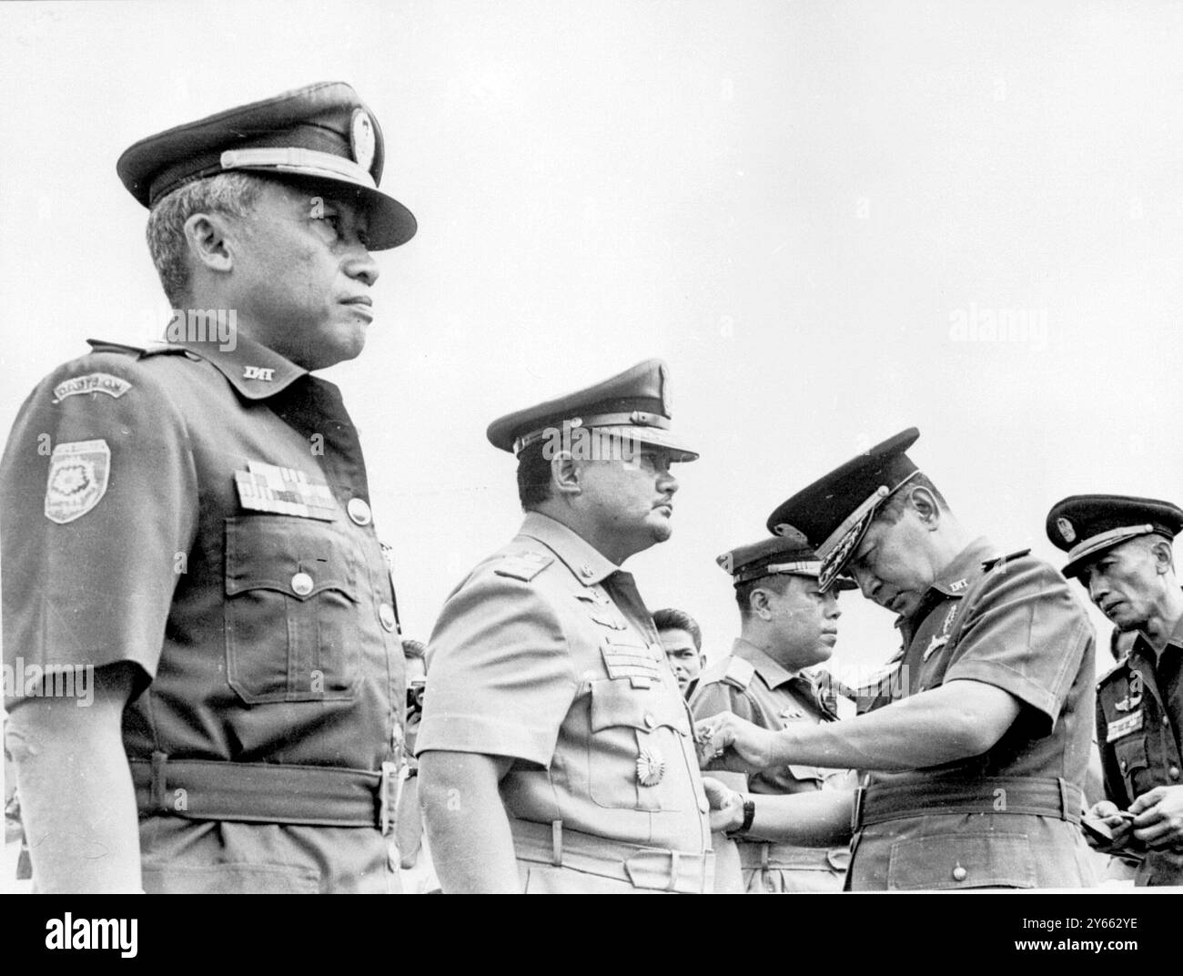 General Suharto pins the command badges on the three new commanders ...