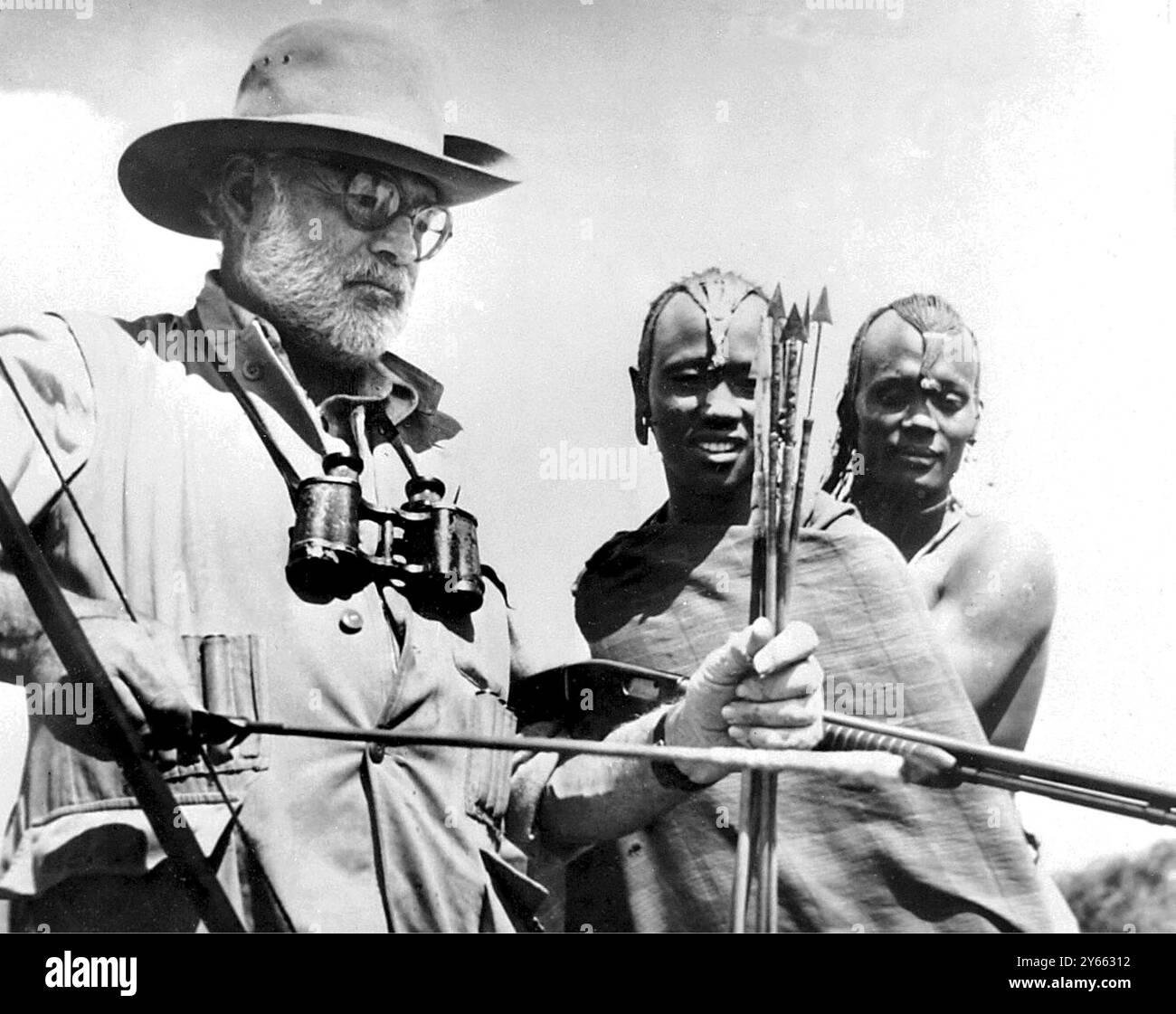 Ernest Hemingway pictured in Africa with two tribesmen in 1954 Stock ...