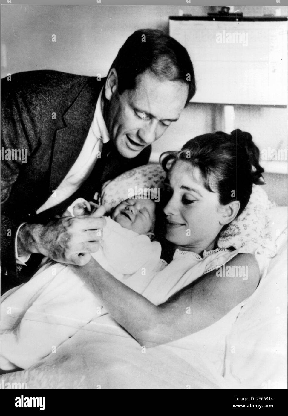 Audrey Hepburn cuddling her new born baby, Sean with actor husband Mel ...