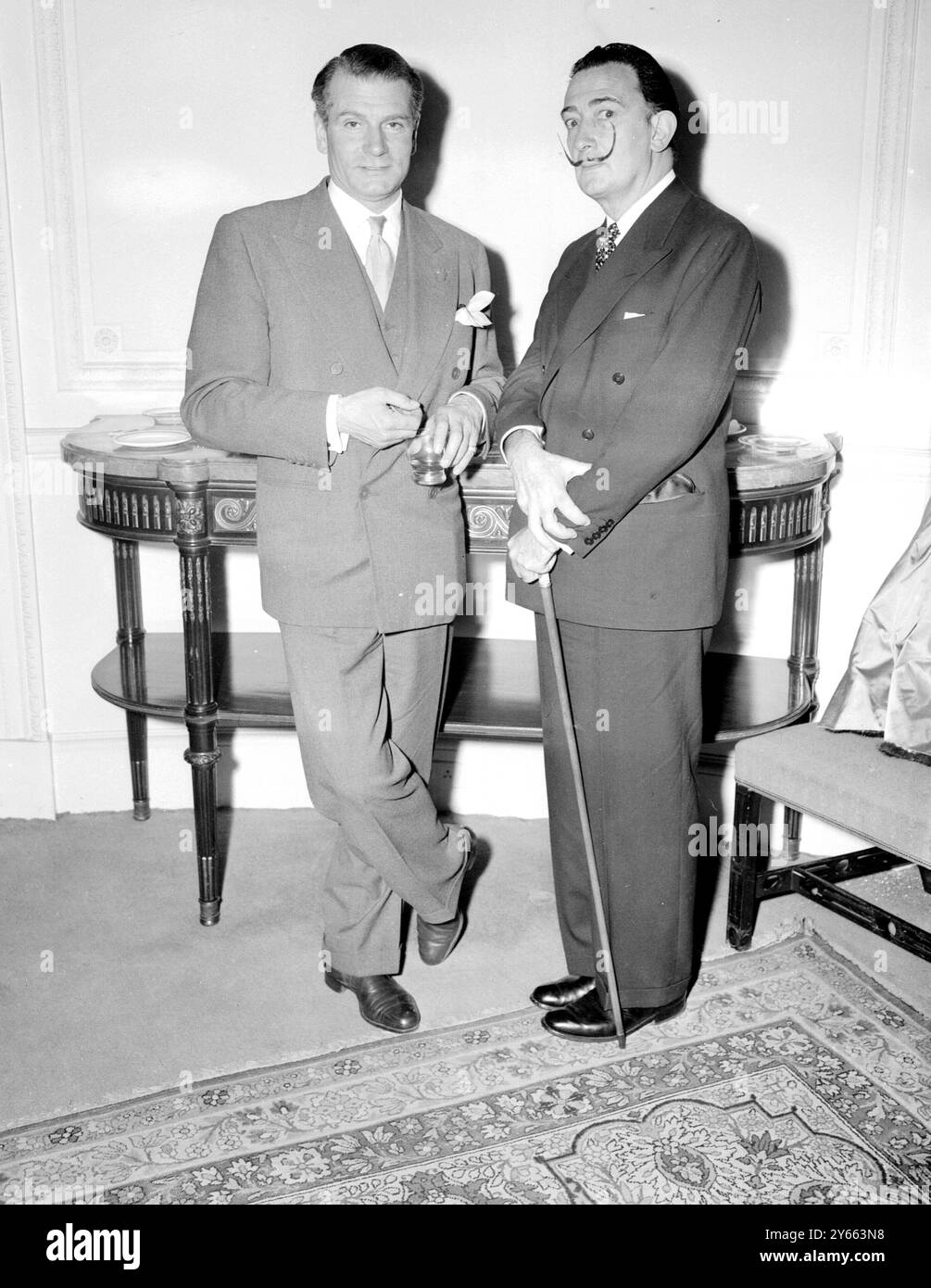 Salvador Dali and Sir Laurence Olivier. Dali is in London to paint ...