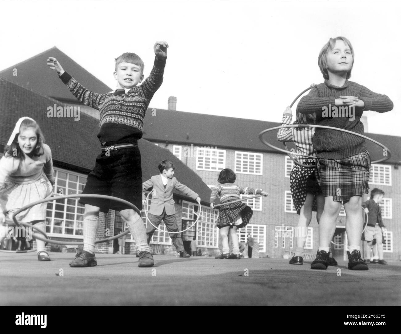 Children Hula - Hooping in the school playground. 23 December 1960 ...