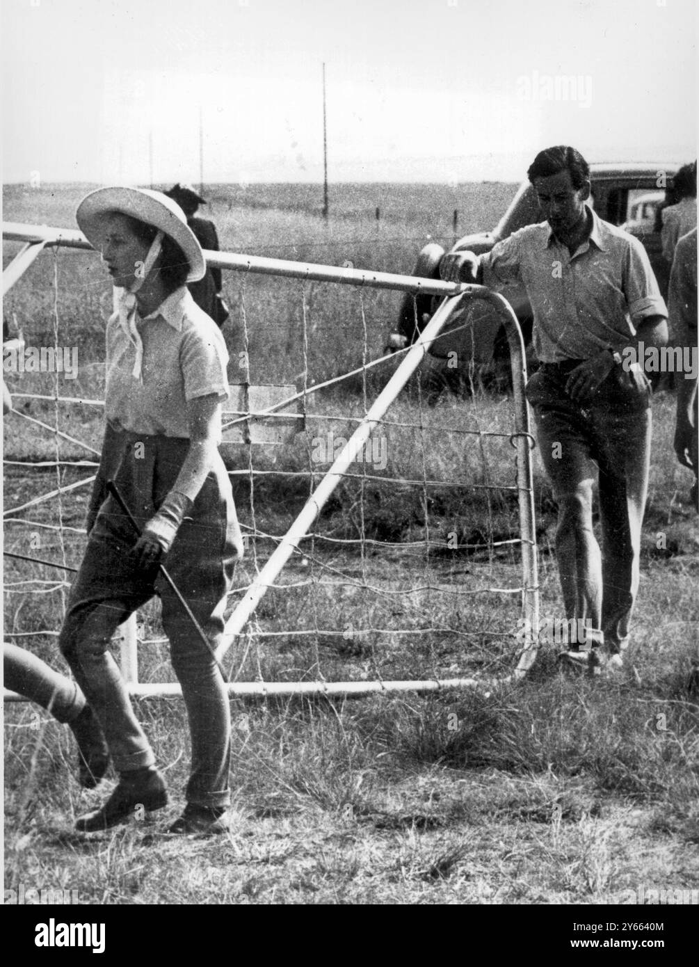Group Captain Peter Townsend follows Princess Margaret who wears riding ...