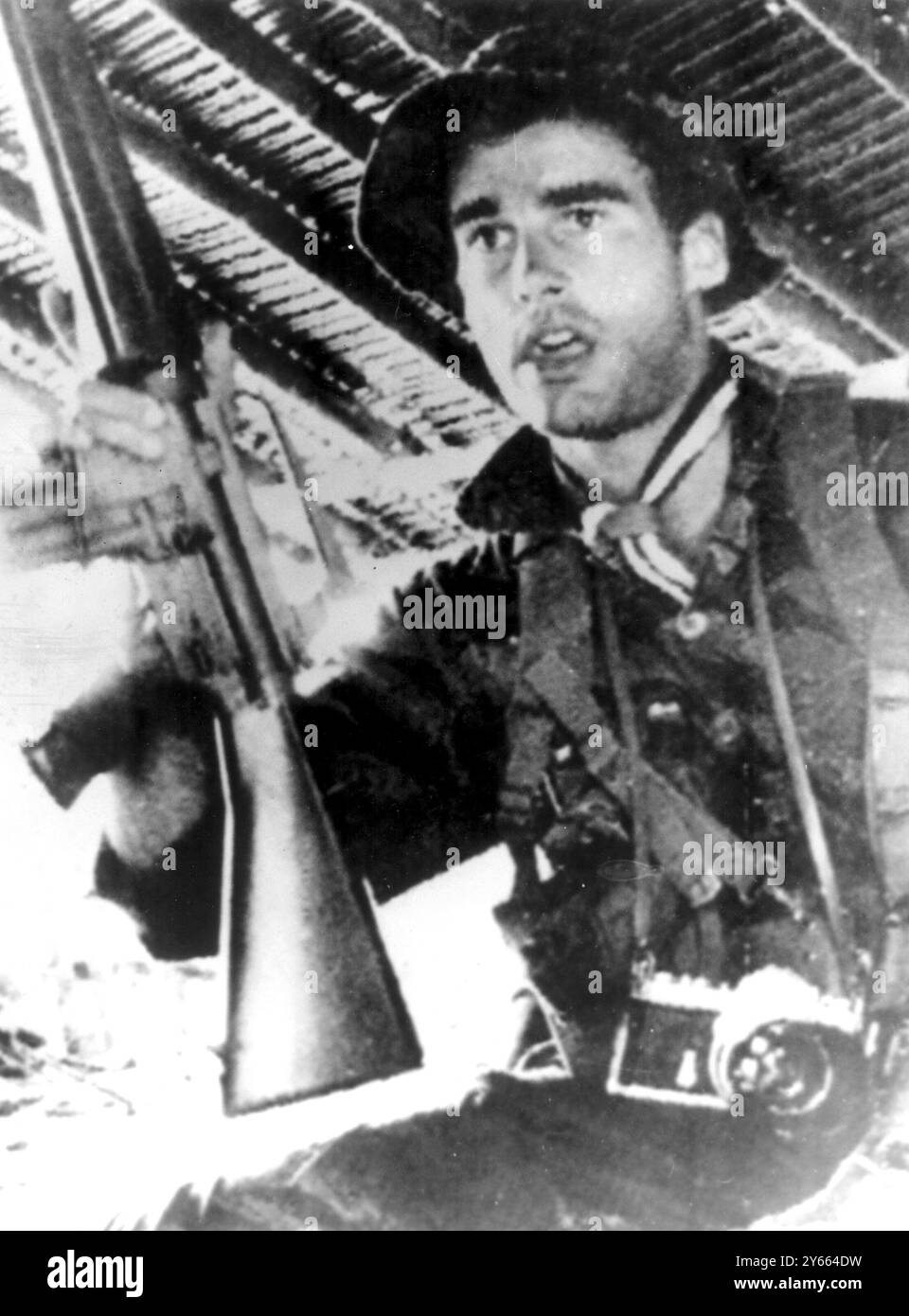 Sean Flynn - son of Errol. Carrying a rifle and a camera during a tour ...