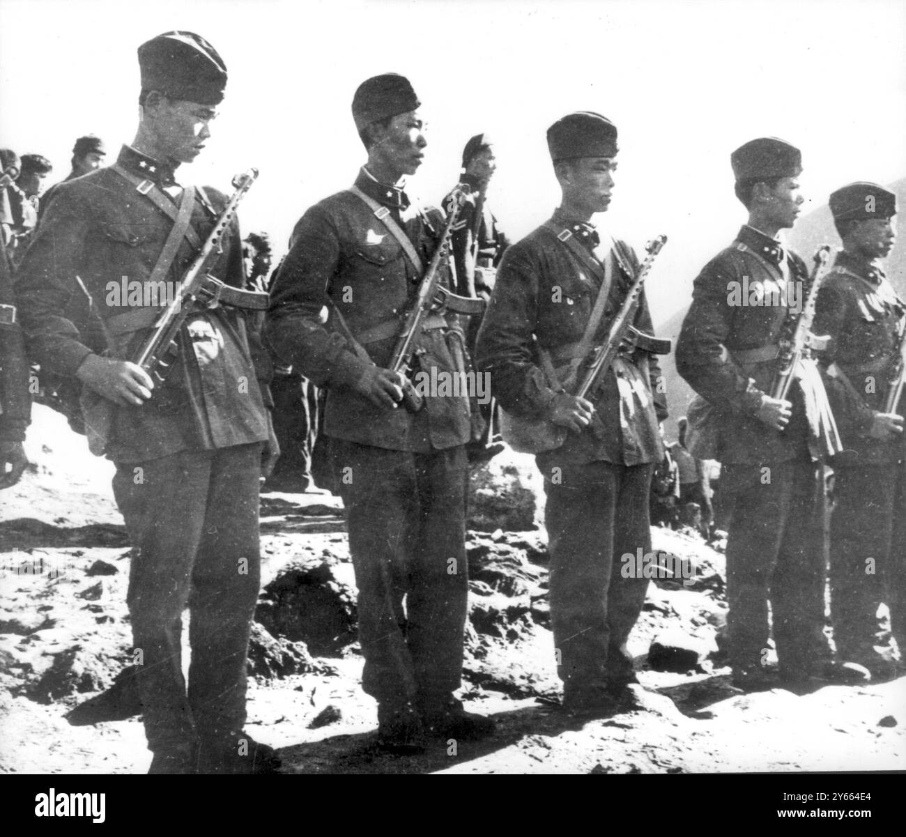 Communist Chinese troops are shown here standing guard near the Tibetan ...