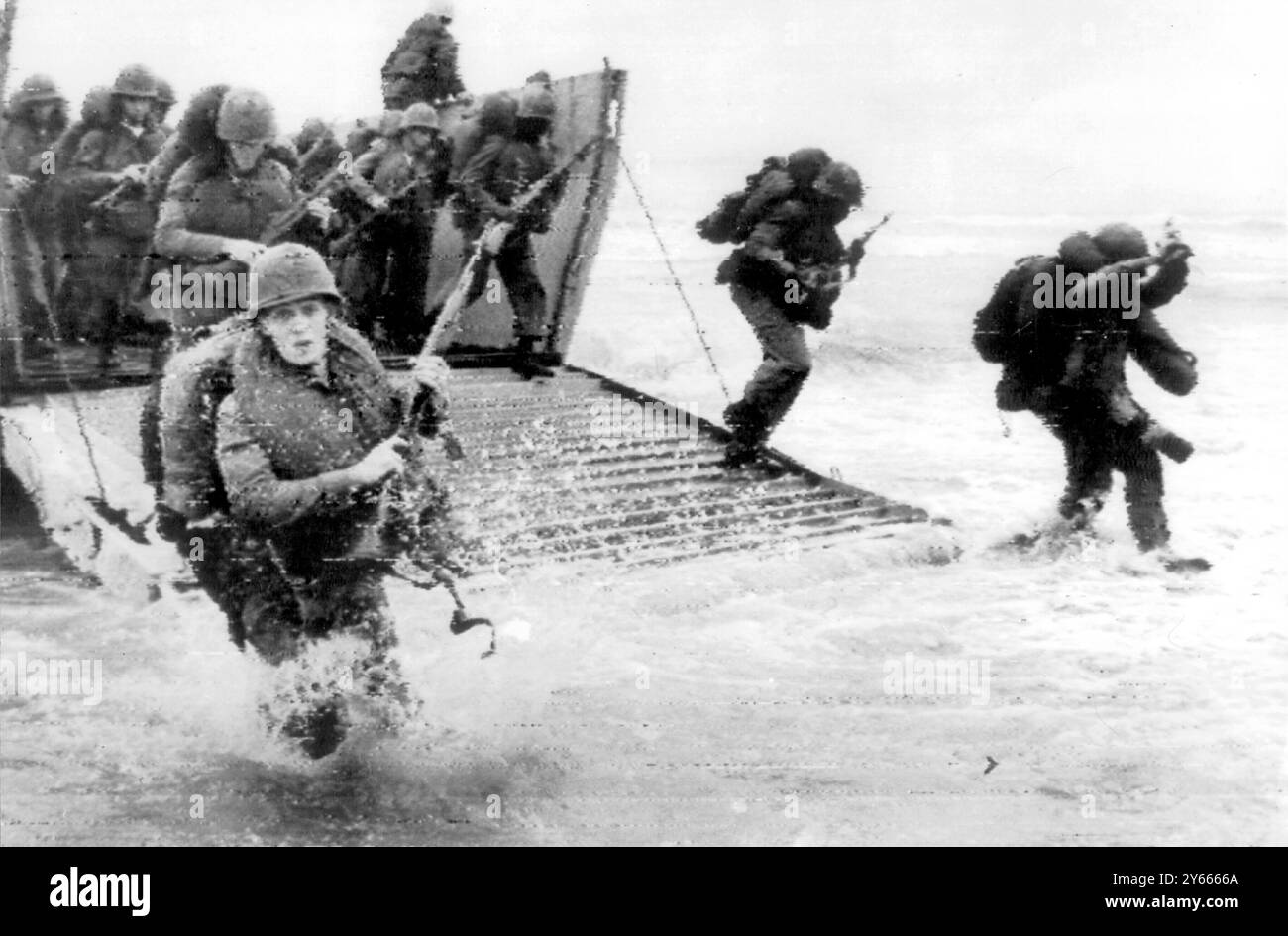 US Marines race ashore from LVT's which brought them to Da Nang, South ...