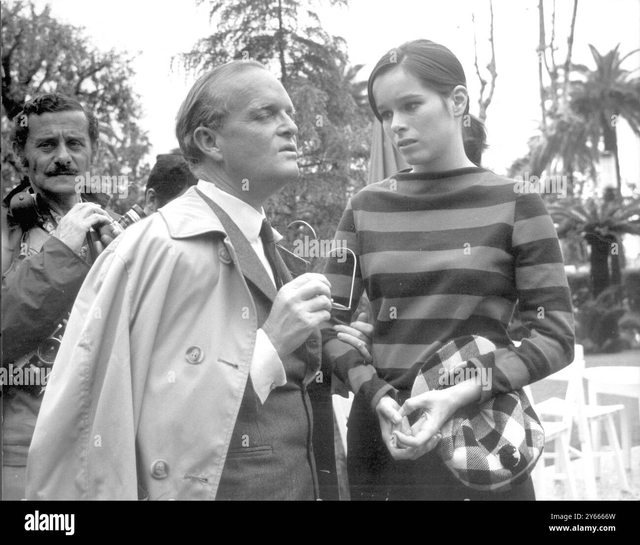 Actress Geraldine Chaplin chatting with American writer Truman Capote at the Film Festival in ...