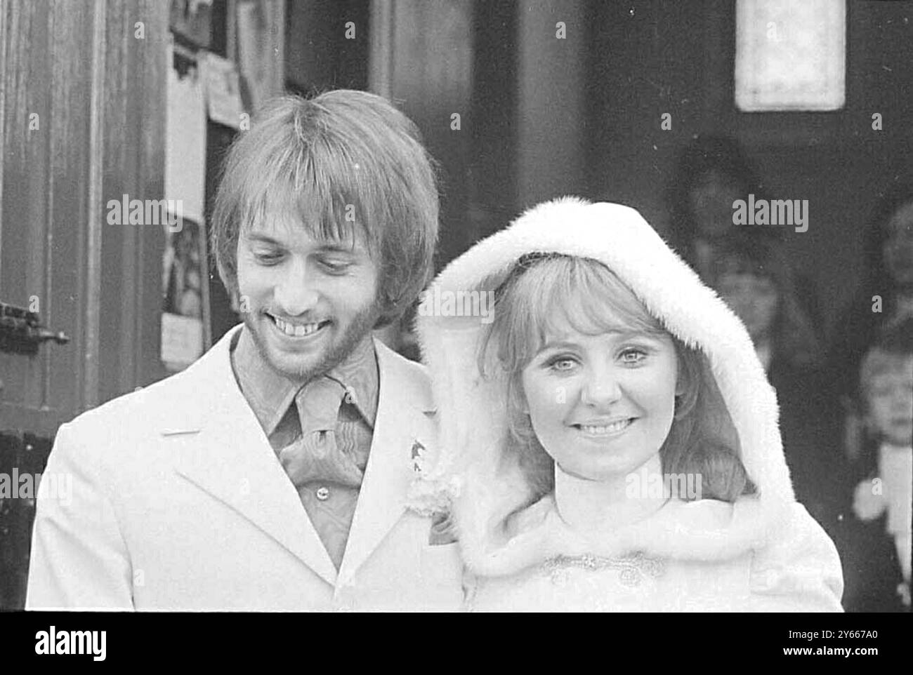 Pop singer Lulu with Maurice Gibb of the Bee Gees group smiling happily ...