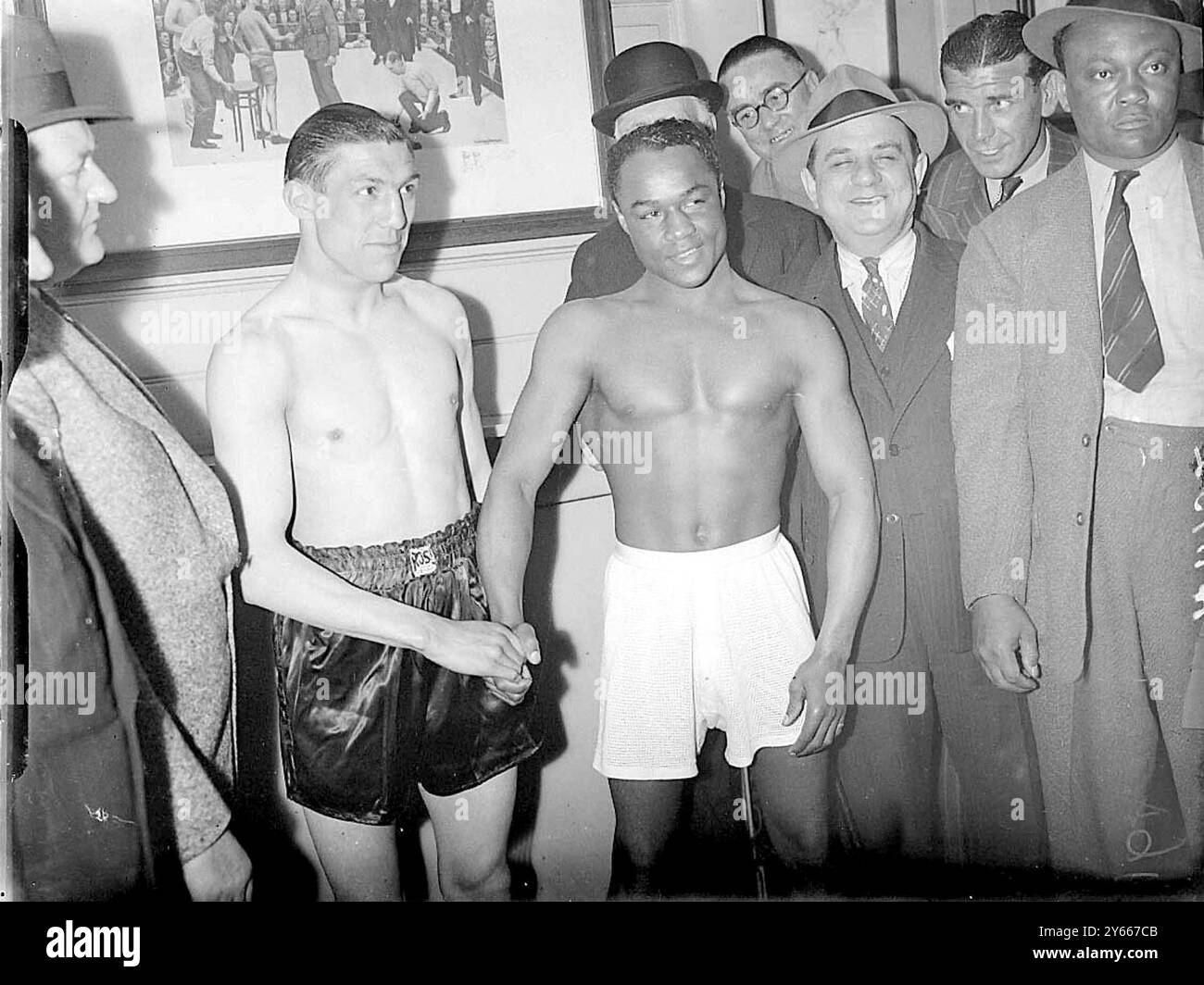 At the weigh-in for their Harringay fight , Ernie Roderick and Henry ...