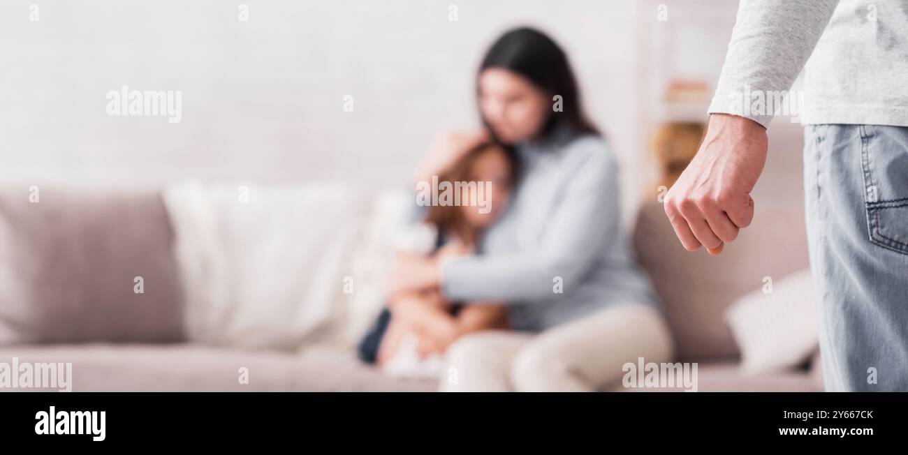 Domestic abuse. Scared woman and little girl suffering from father's ...
