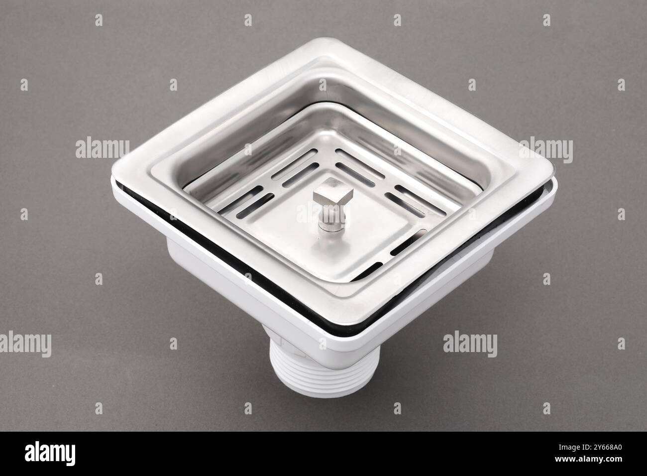 Closeup of sink waste coupling square chrome stainless steel silver ...