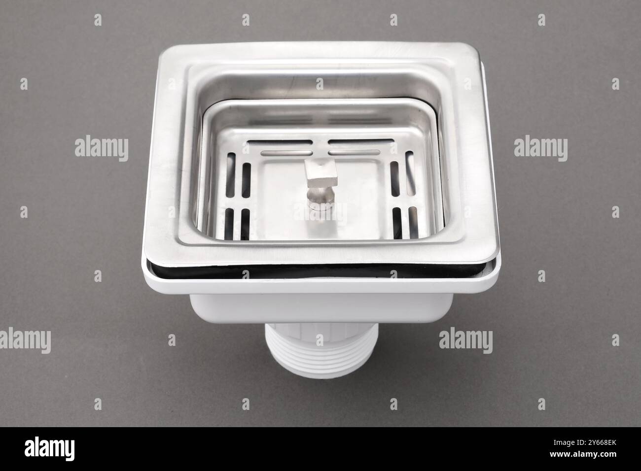 Closeup of sink waste coupling square chrome stainless steel silver ...