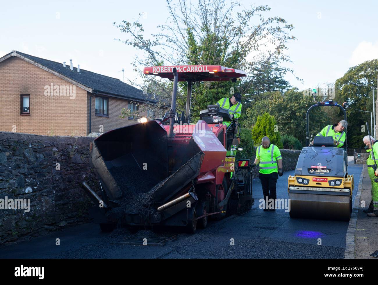 Workmen repairing road surface, Rhu, Scotland showing tar layer and ...
