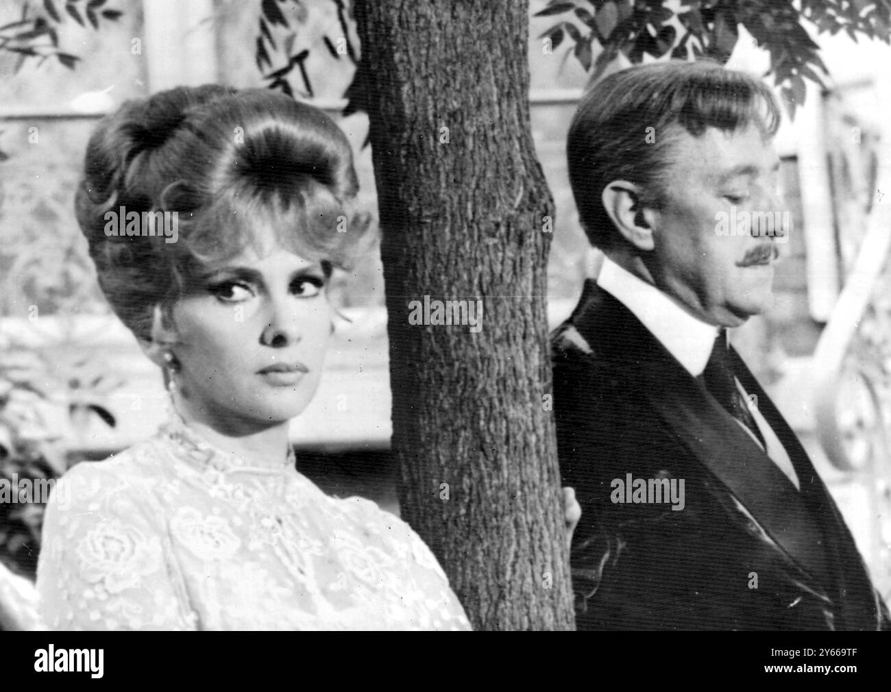 Paris, France: Actress Gina Lollobrigida is blonde for the film eith actor Alec Guinness filming ...