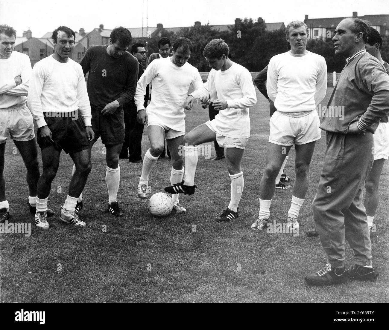 Alf Ramsey talking to members of the England World Cup squad when they ...