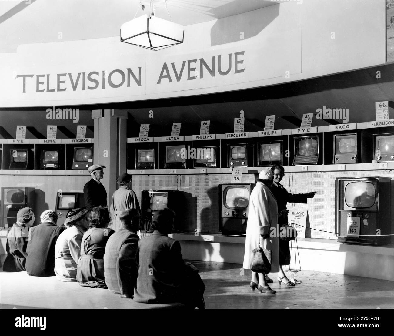 Television sets on show in a London store. The screens showing a cross ...