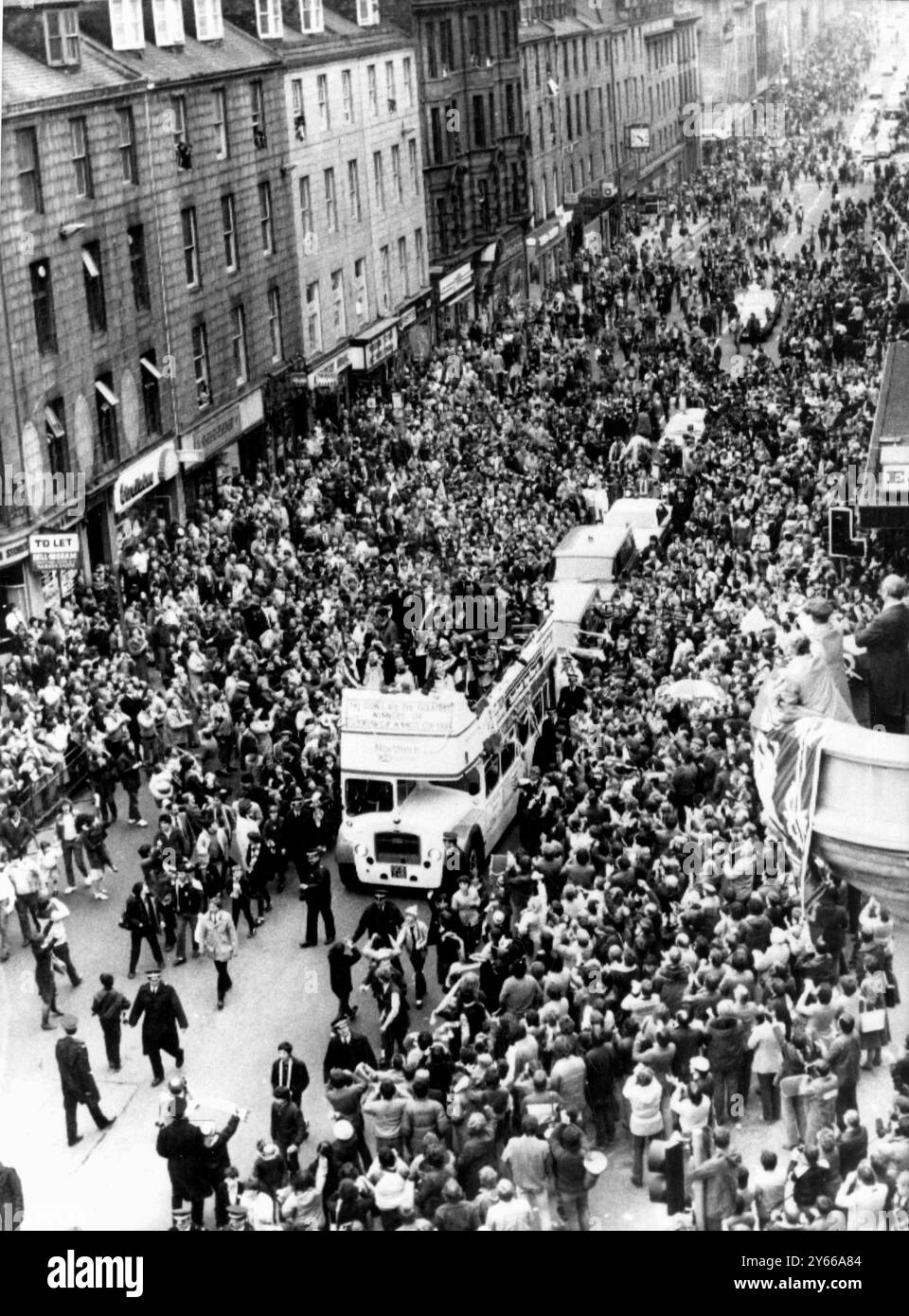 An open top bus carrying the victorious Aberdeen football team to the ...