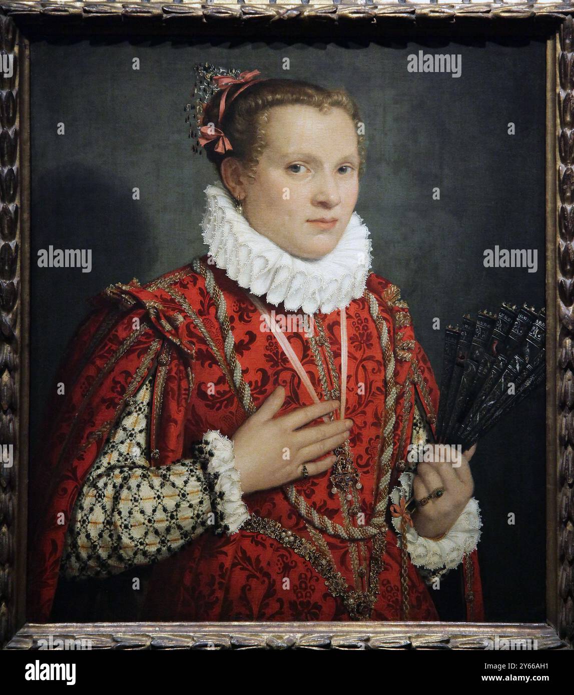 Portrait of a young woman holding a fan by Giovanni Battista Moroni ...
